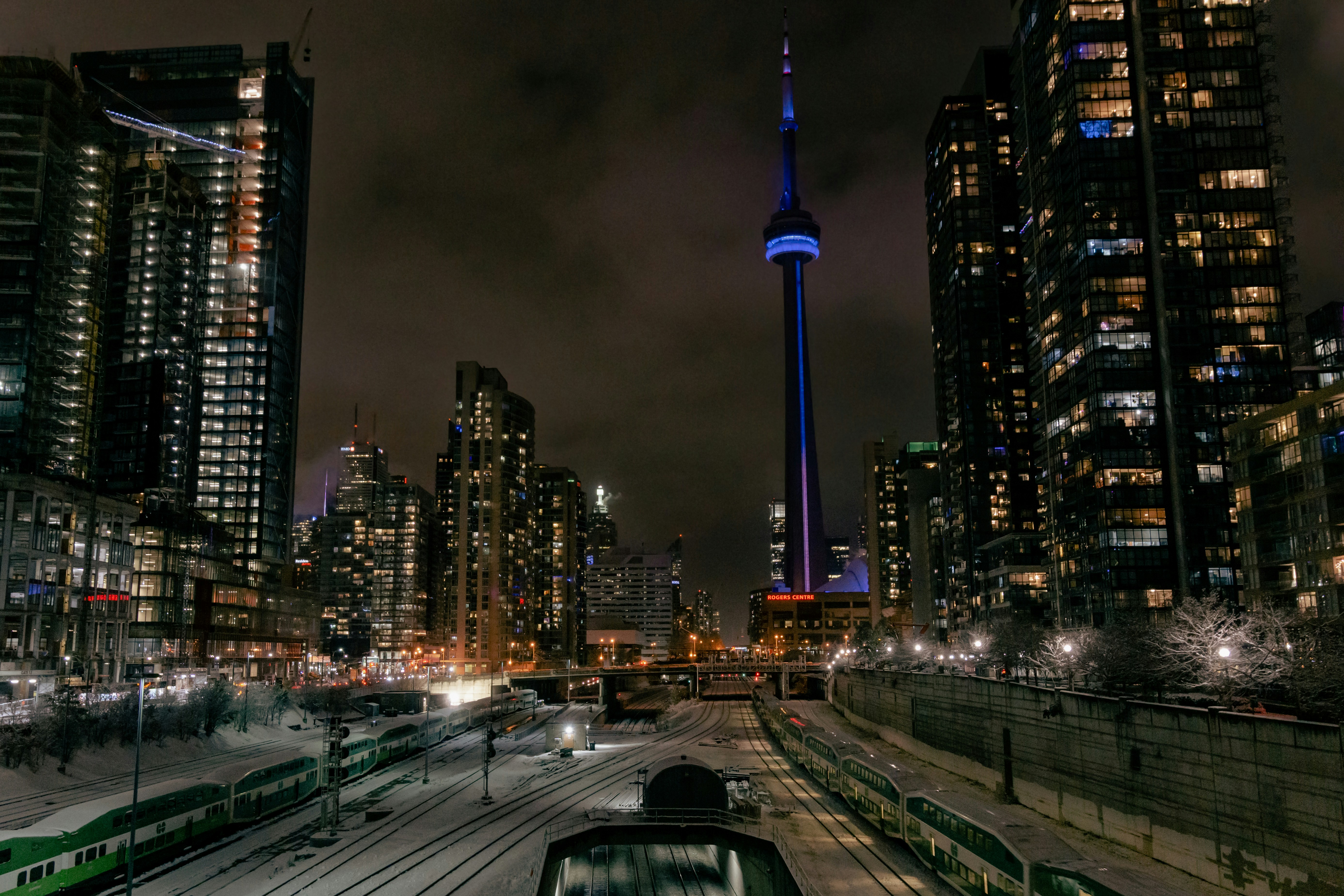 Purple Crown Over Snowbound Rails: Toronto's Night Skyline