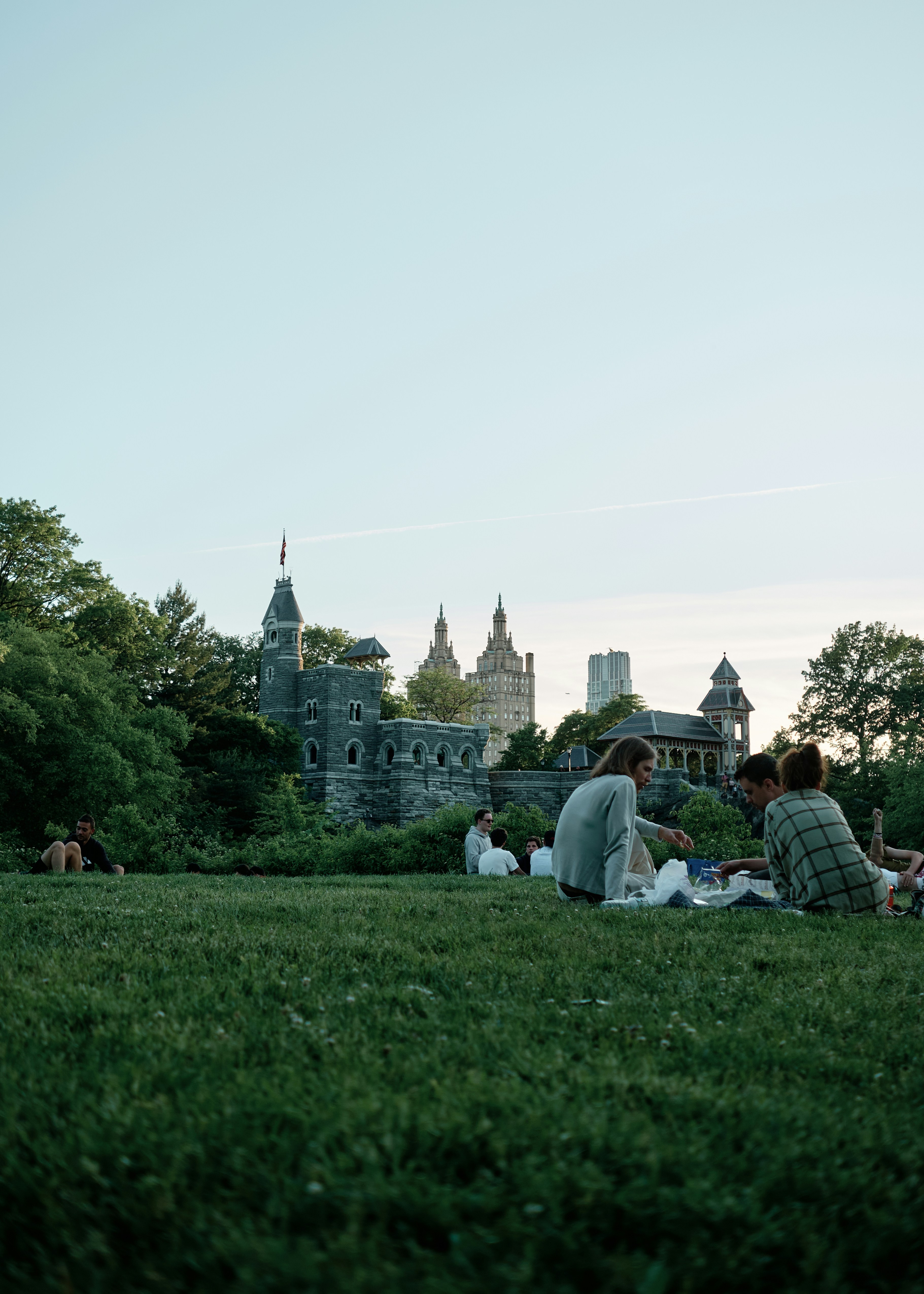Picnic on the Green: Quiet Park with Gothic Turrets Rising in the Background