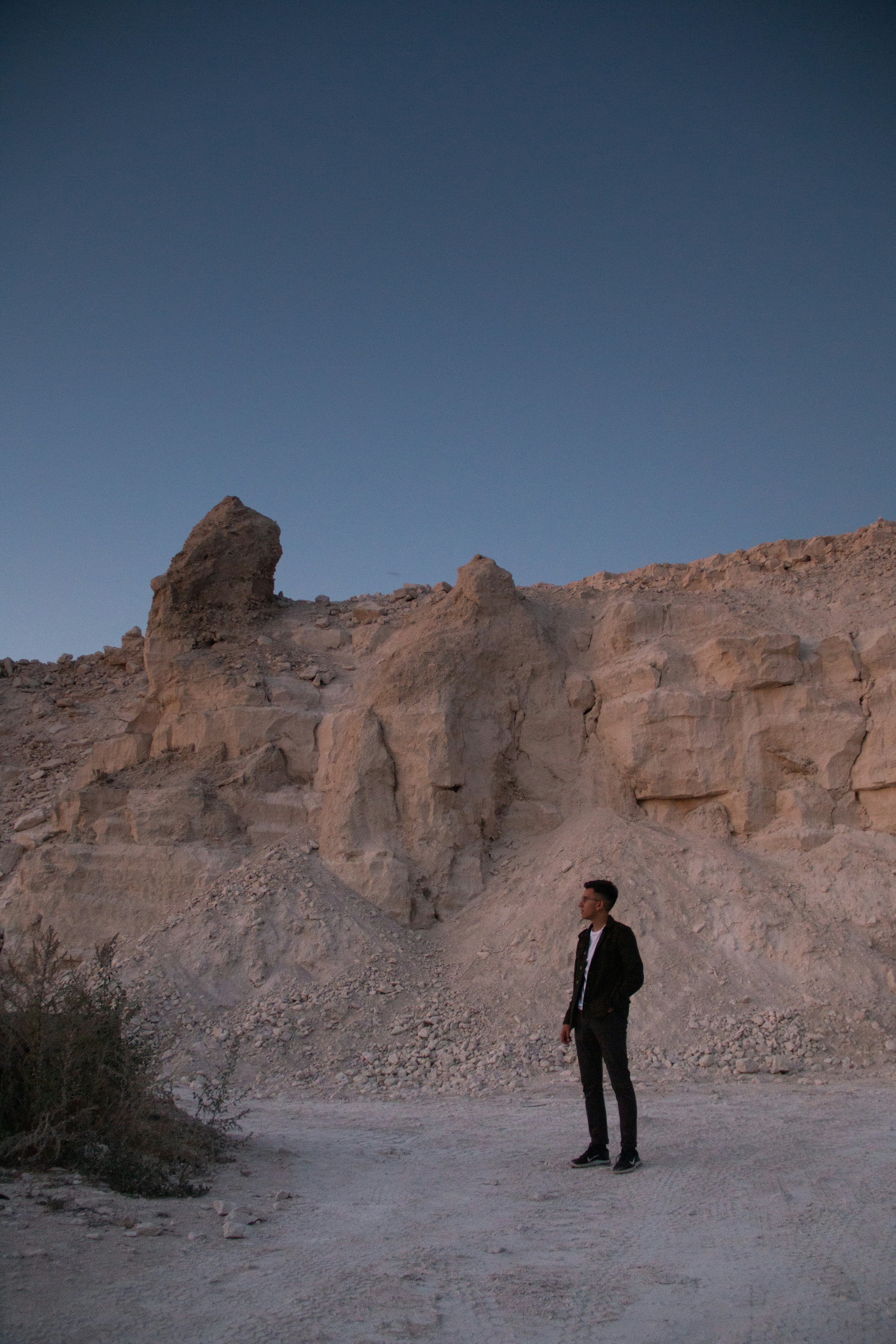 Lone Figure in a Chalky Canyon at DuskFlorin Palamarciuc