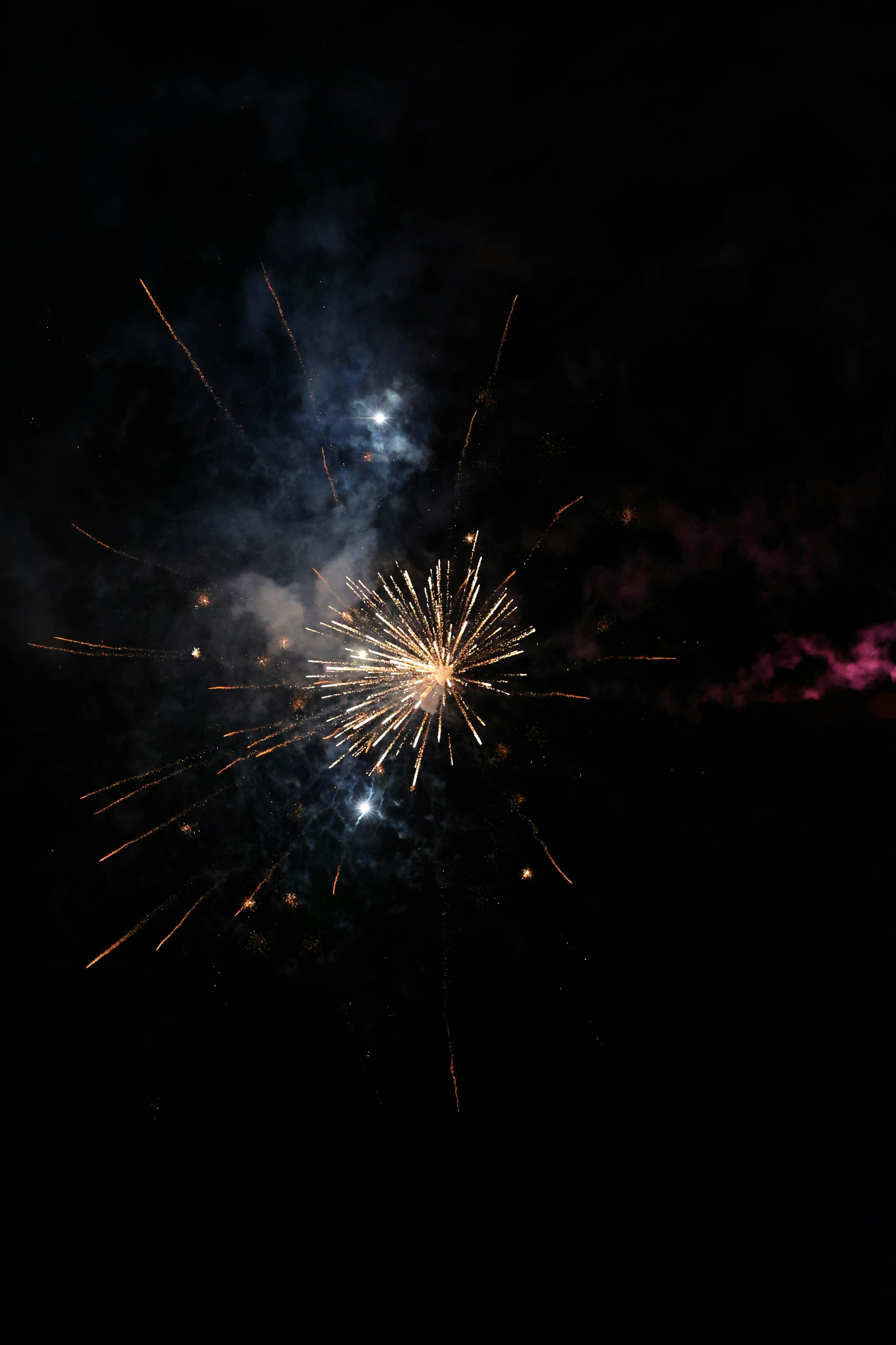 a fireworks is lit up in the night sky