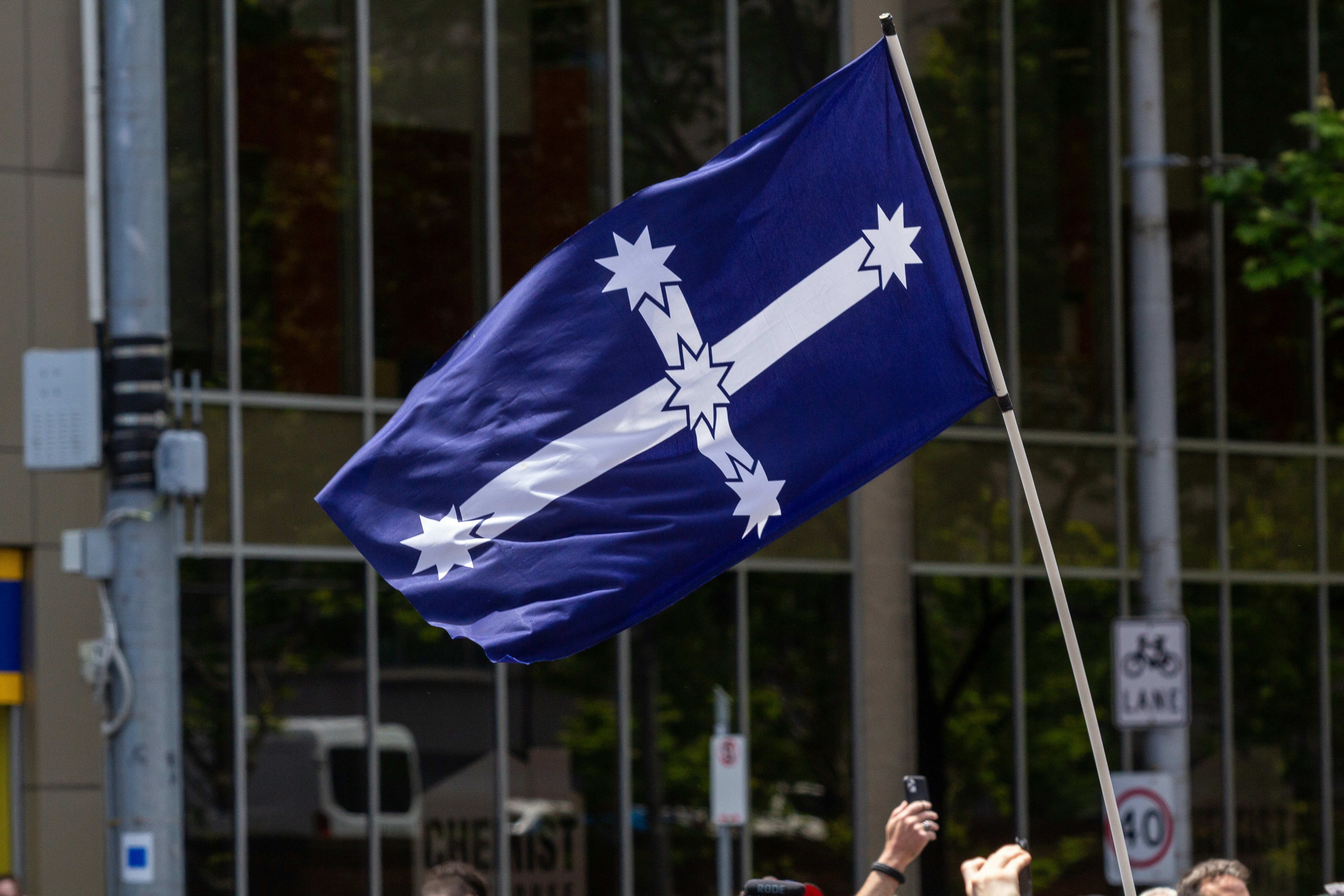 Flag of the Southern Cross Rippling Above a Crowd