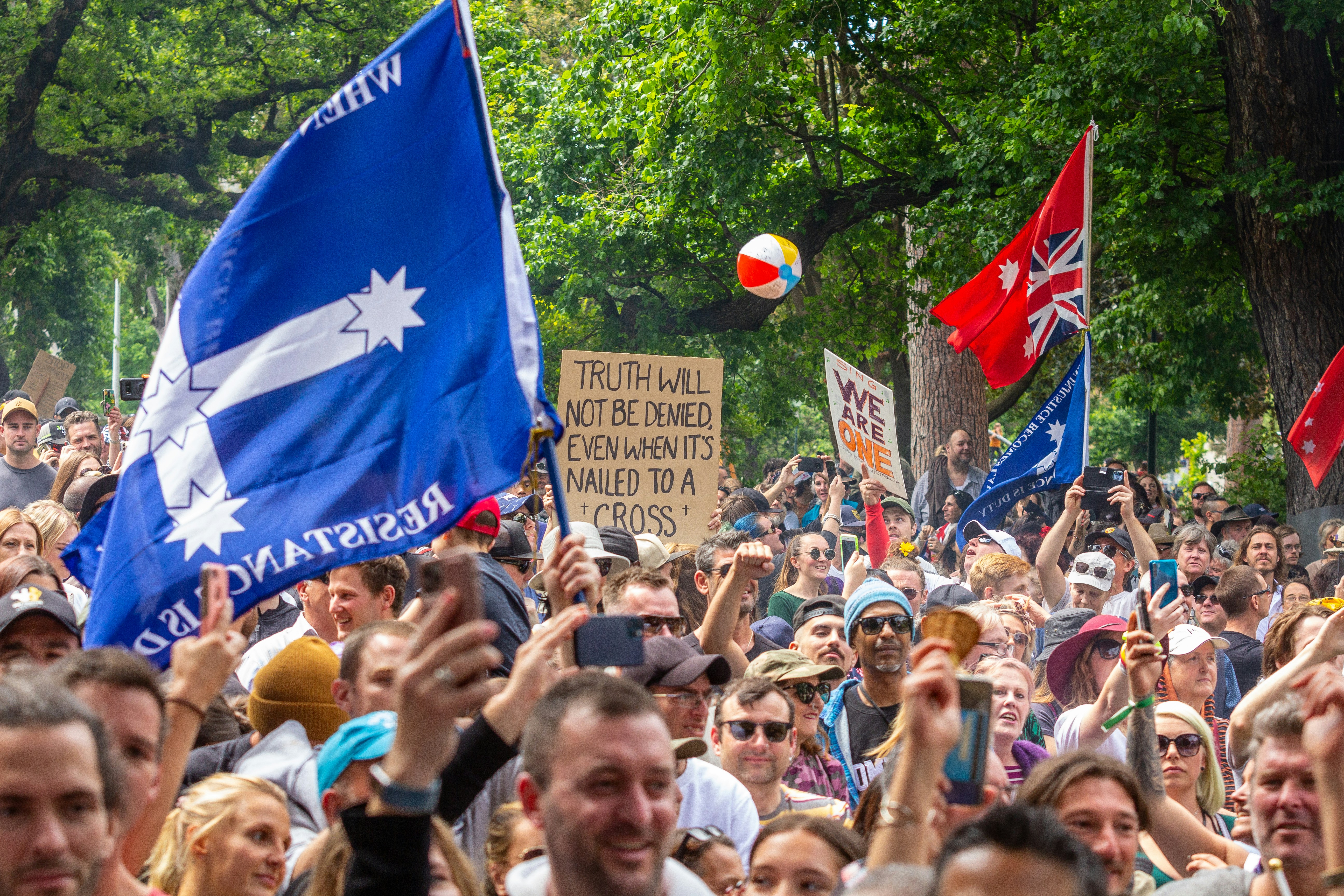 A crowd of people holding flags and signs photo – Free Australia Image ...