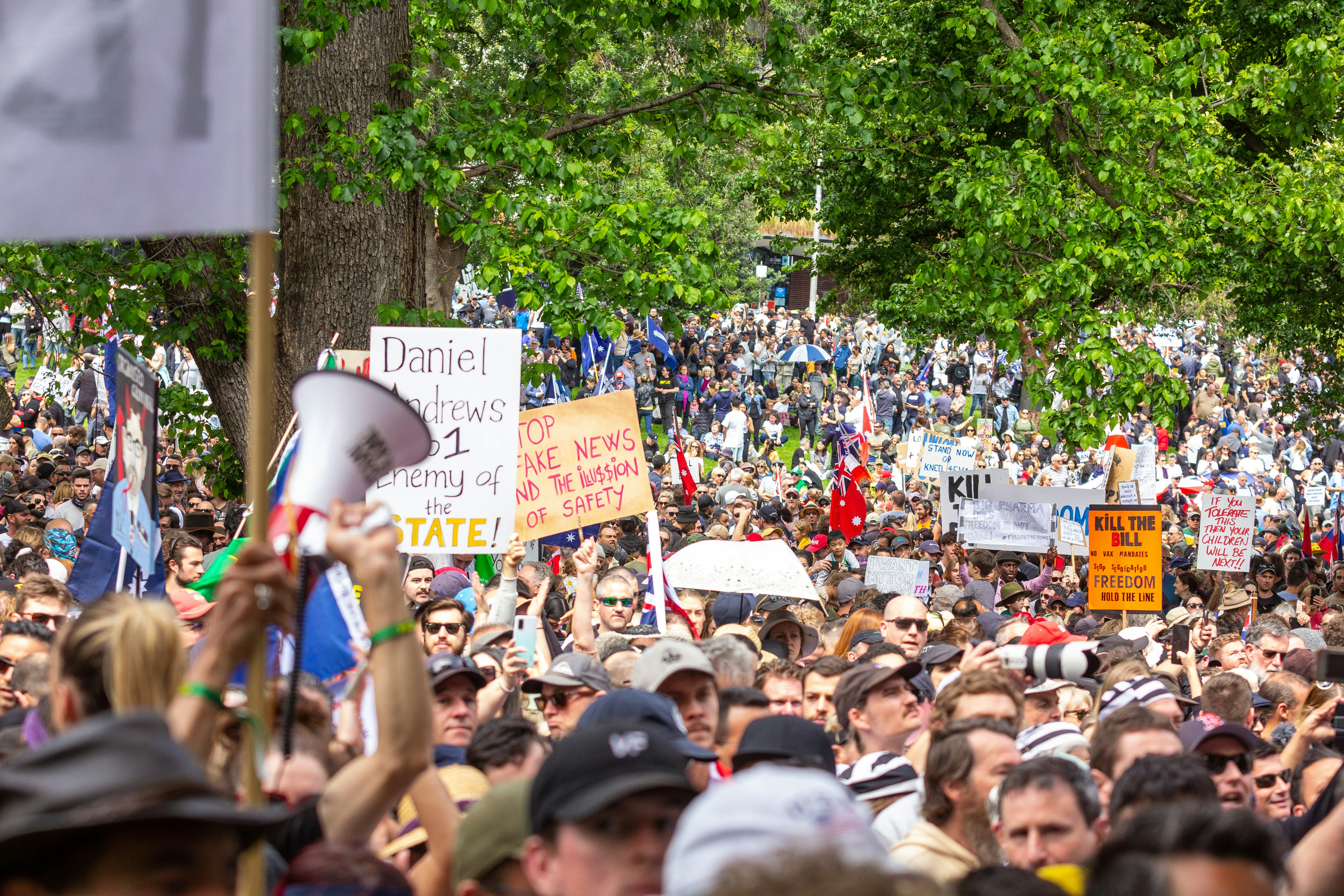 A large crowd of people holding signs and flags photo – Free Australia ...