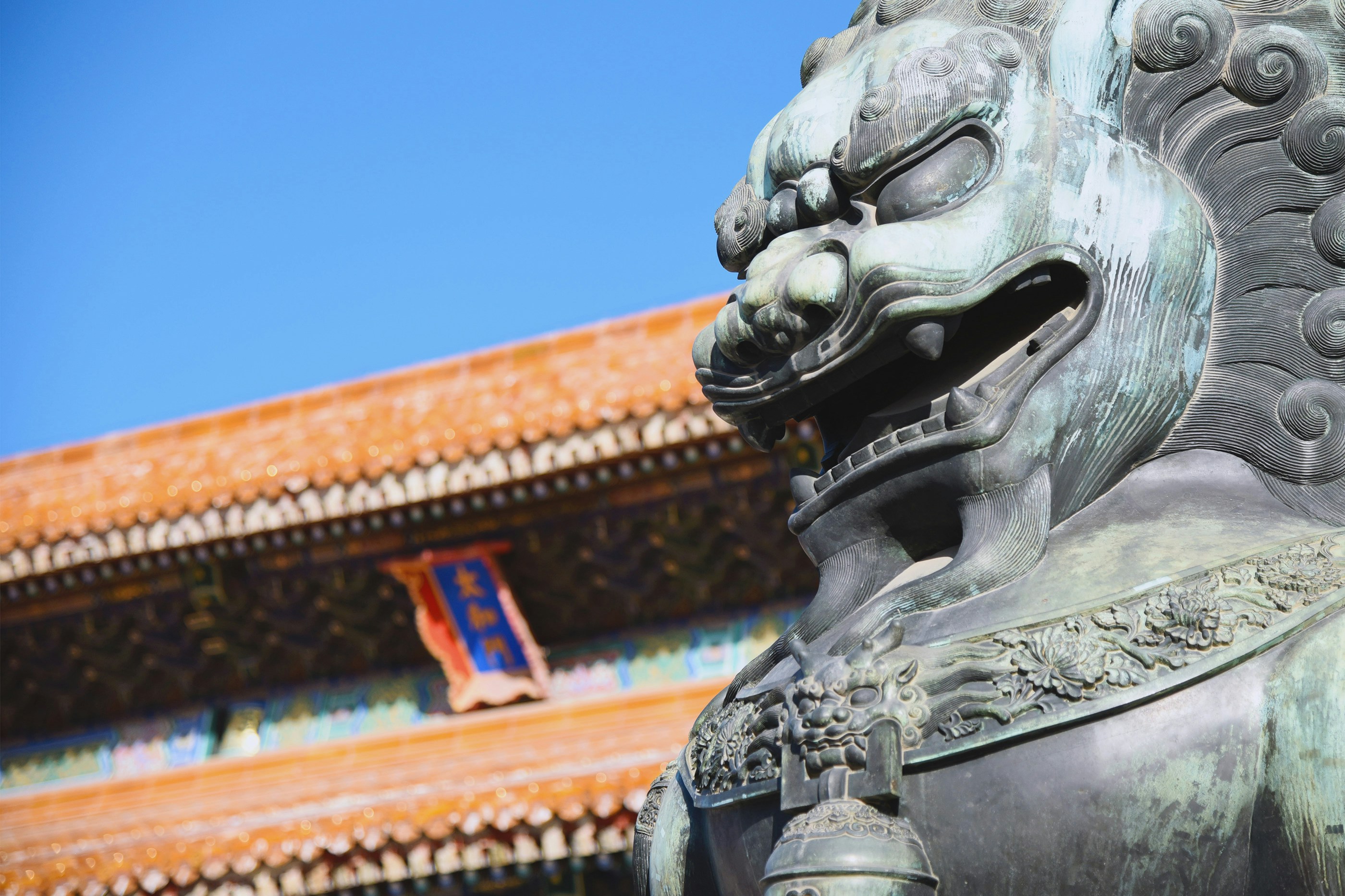 A statue of a lion in front of a building photo – Free Stone lion Image ...