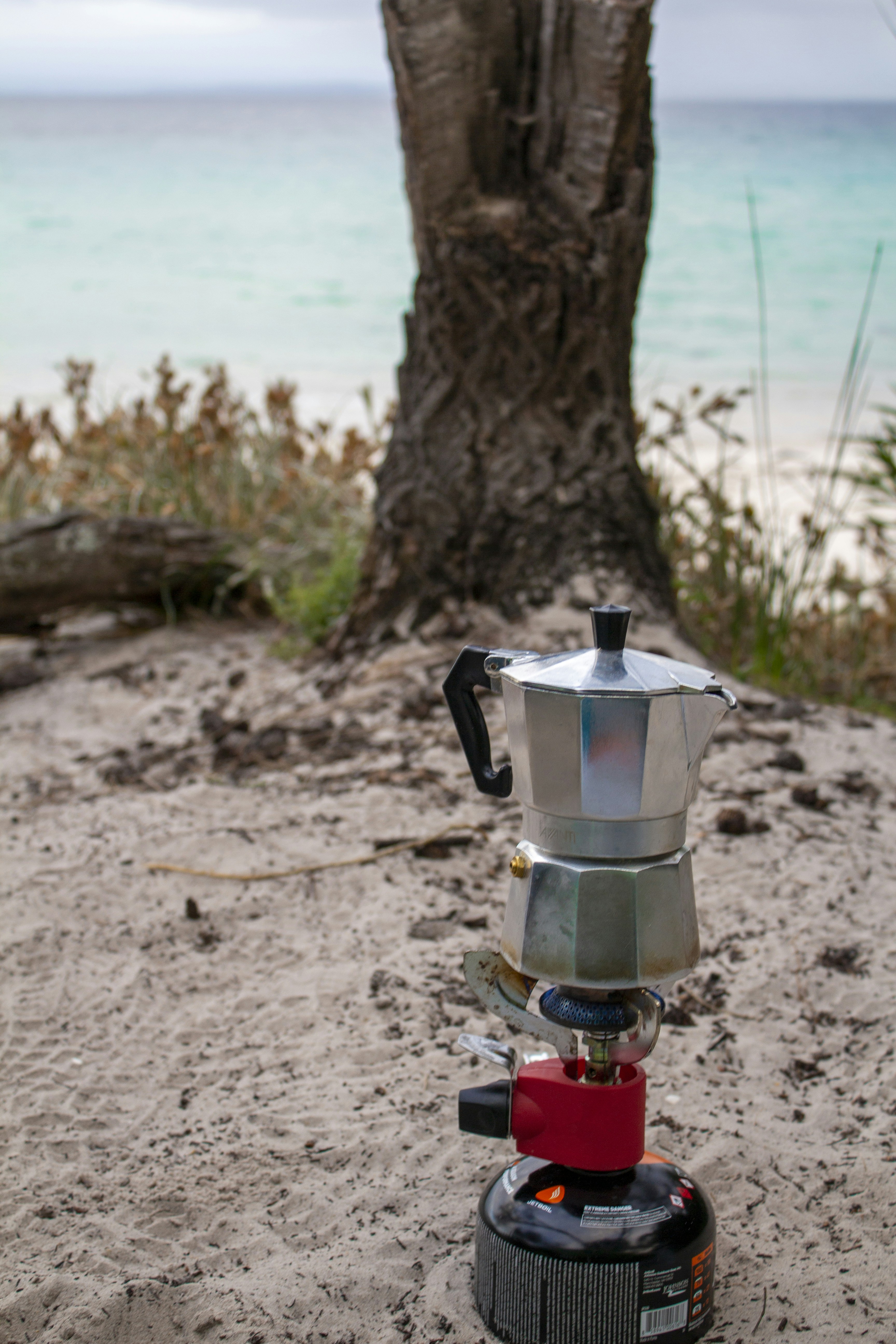 Coastal Brew: Moka Pot on a Beachfront Stove by Turquoise Waters