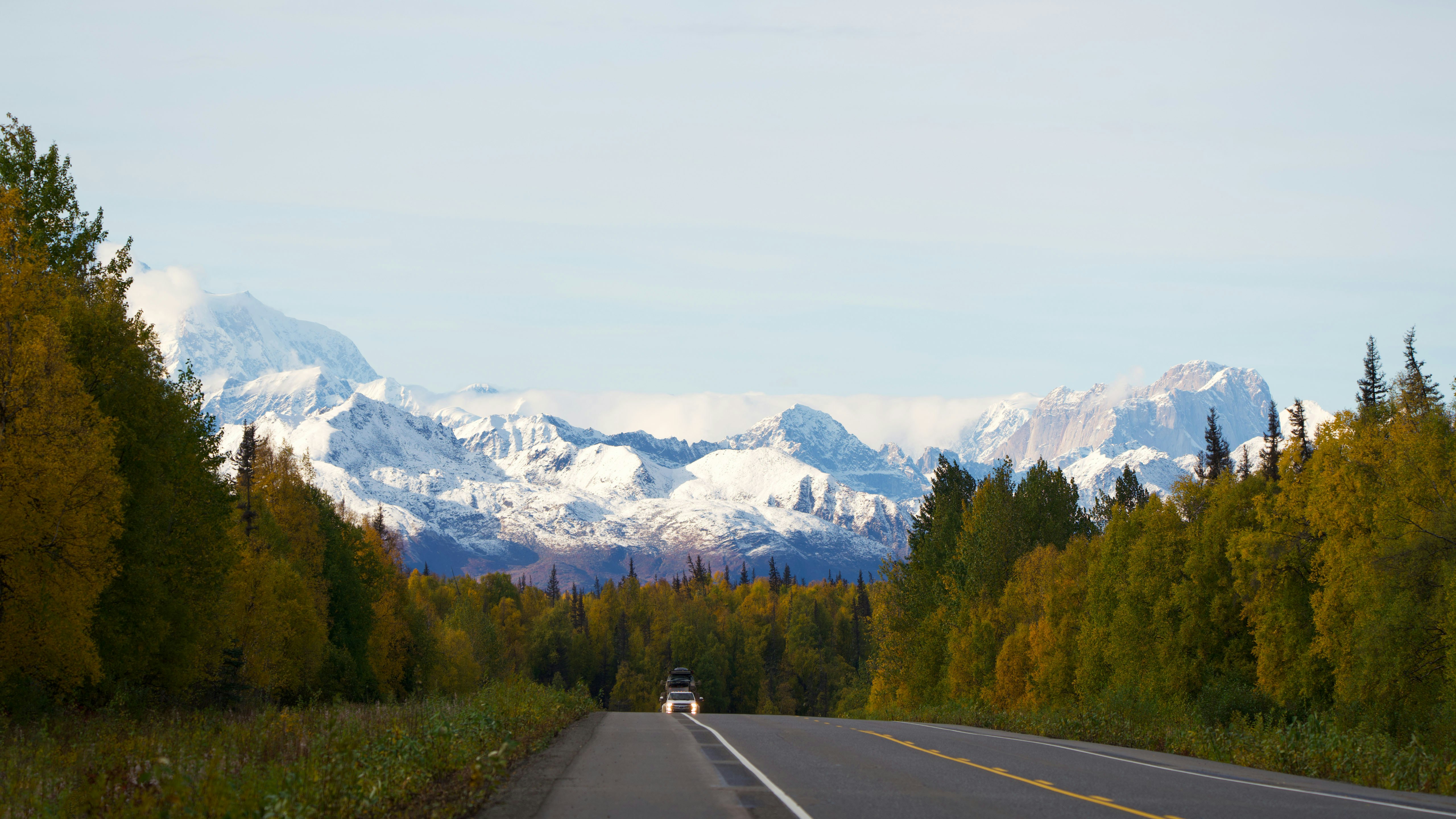 Golden Corridor: A Highway Quietly Toward Snow-Crowned Peaks