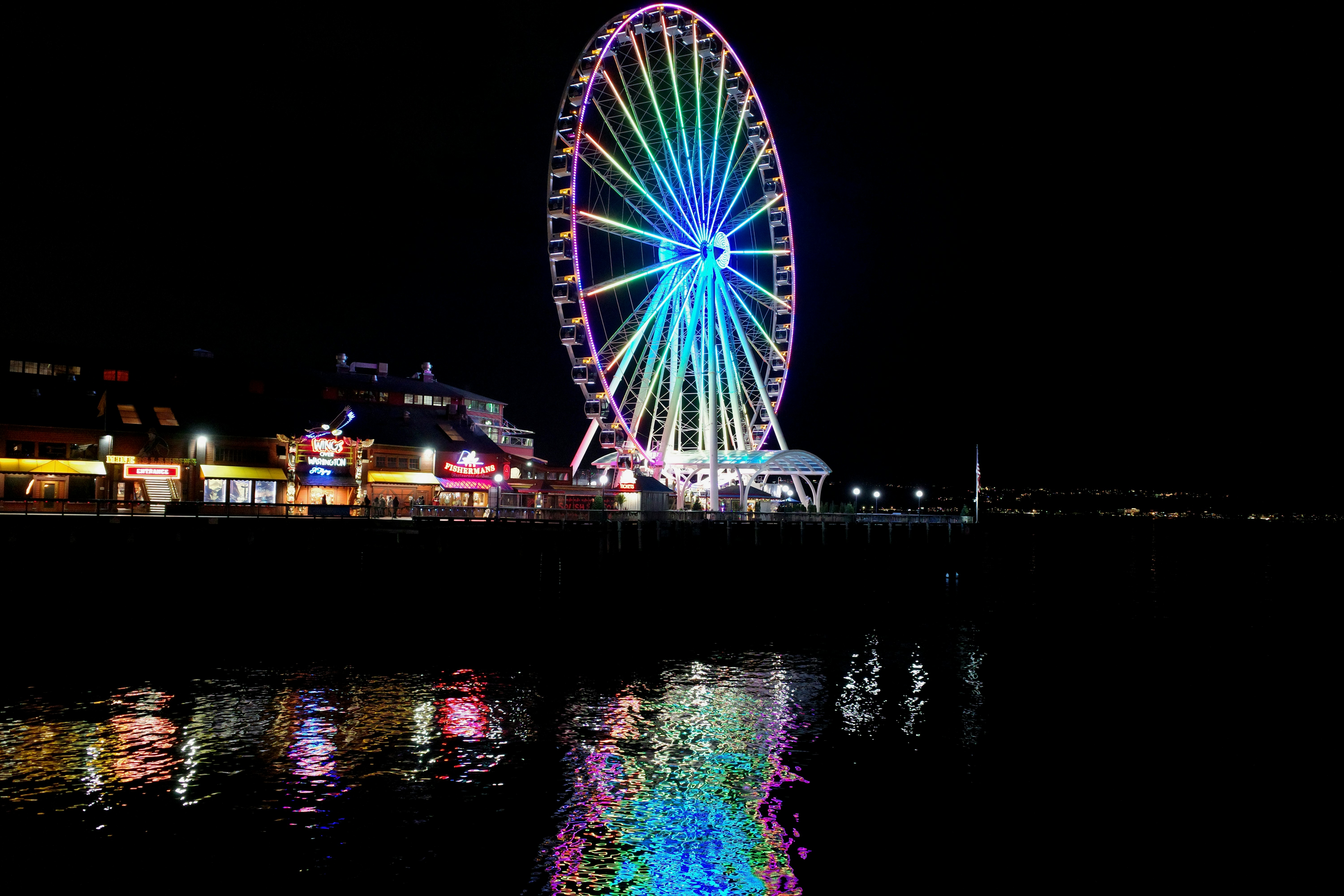 Neon Orbit over a Moonlit Pier