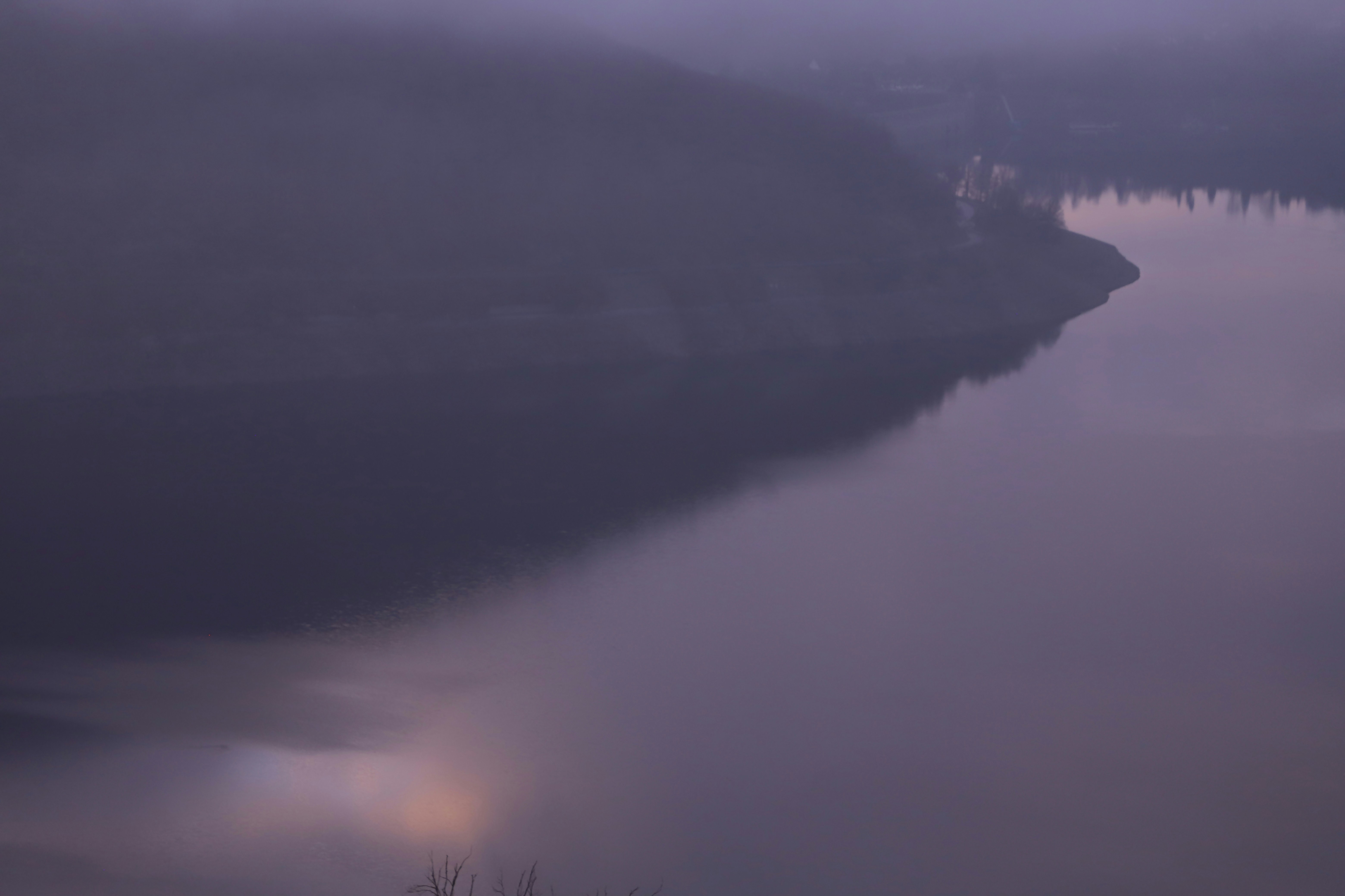 A body of water surrounded by fog and trees photo – Free Grey Image on ...