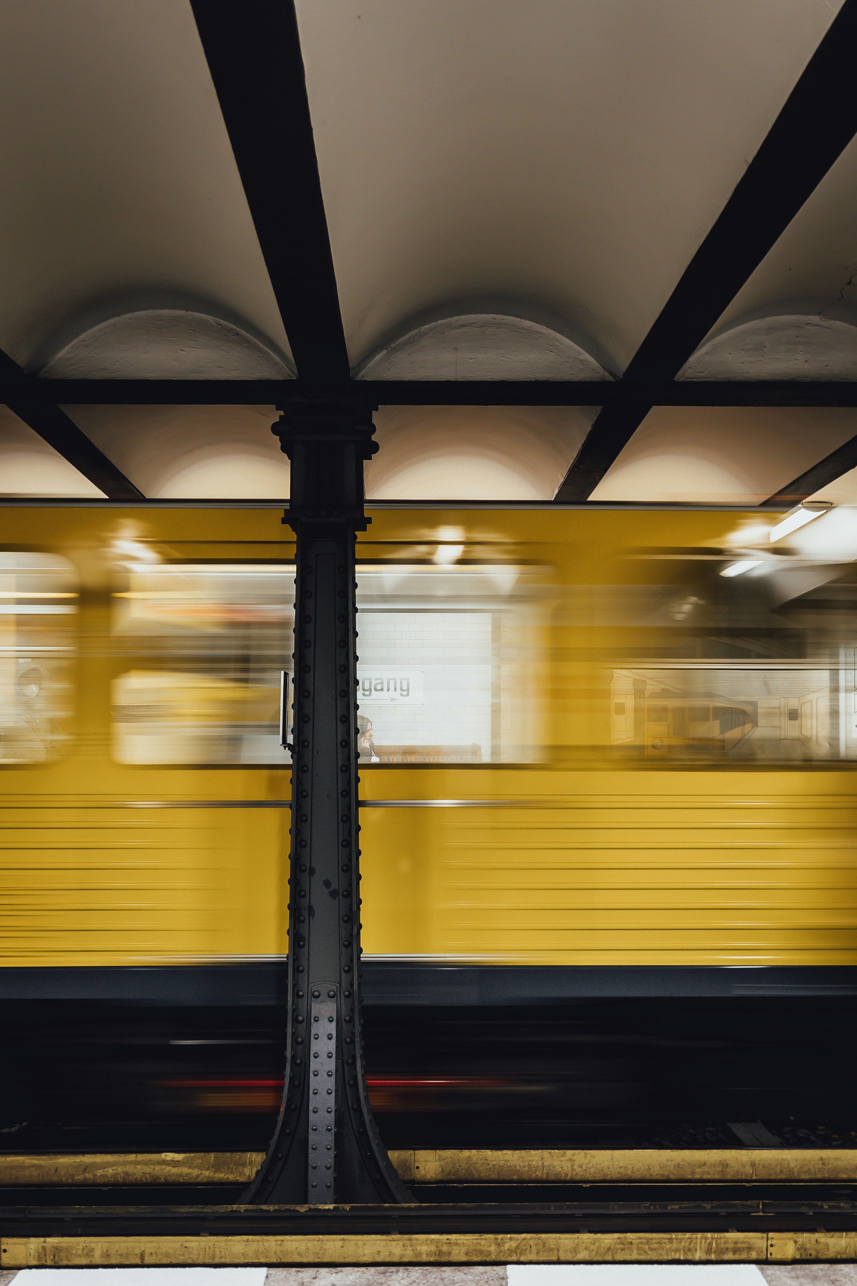 A train passing by a platform in a train station photo – Free Berlin ...
