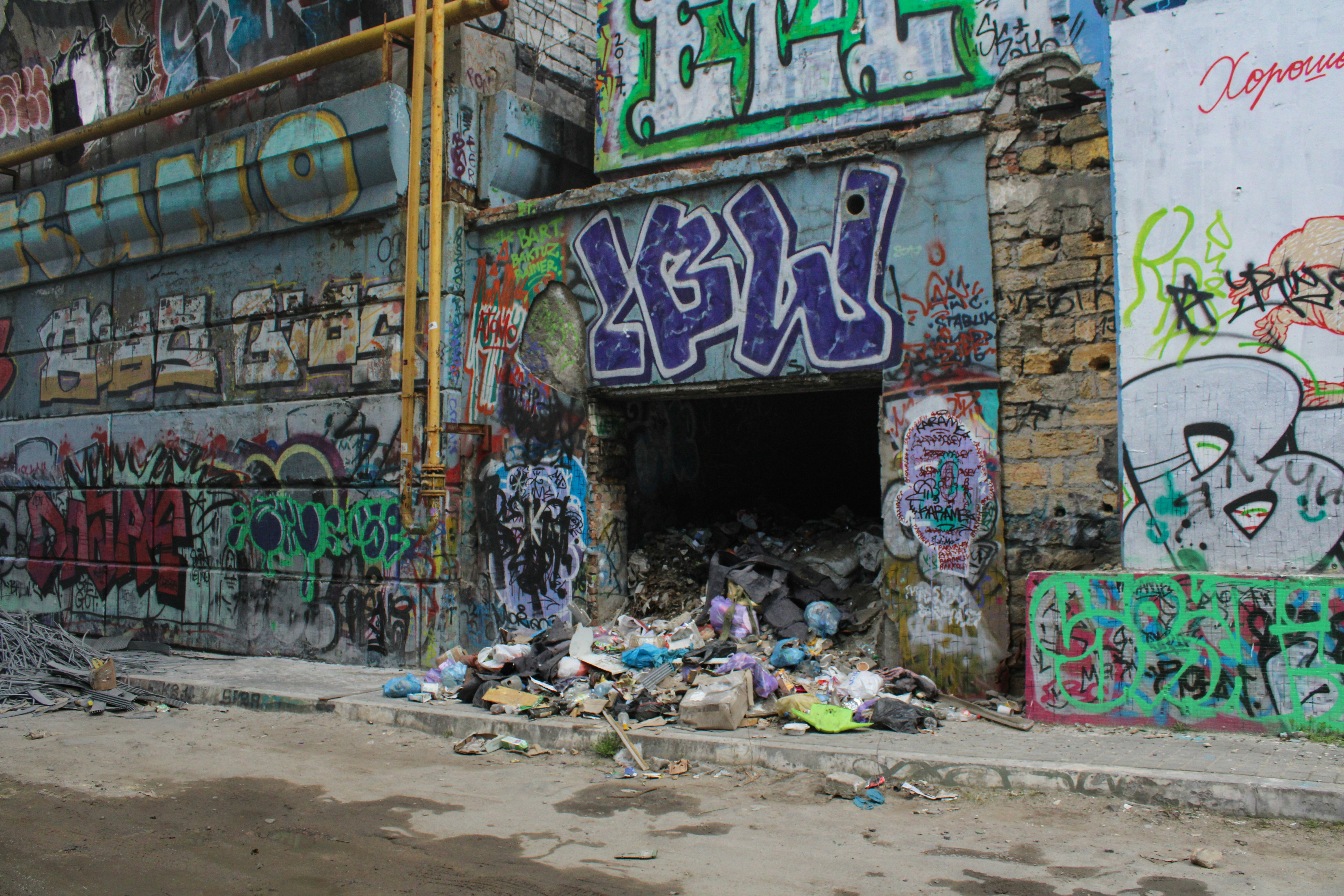 A bunch of graffiti on the side of a building photo – Free Urban Image ...
