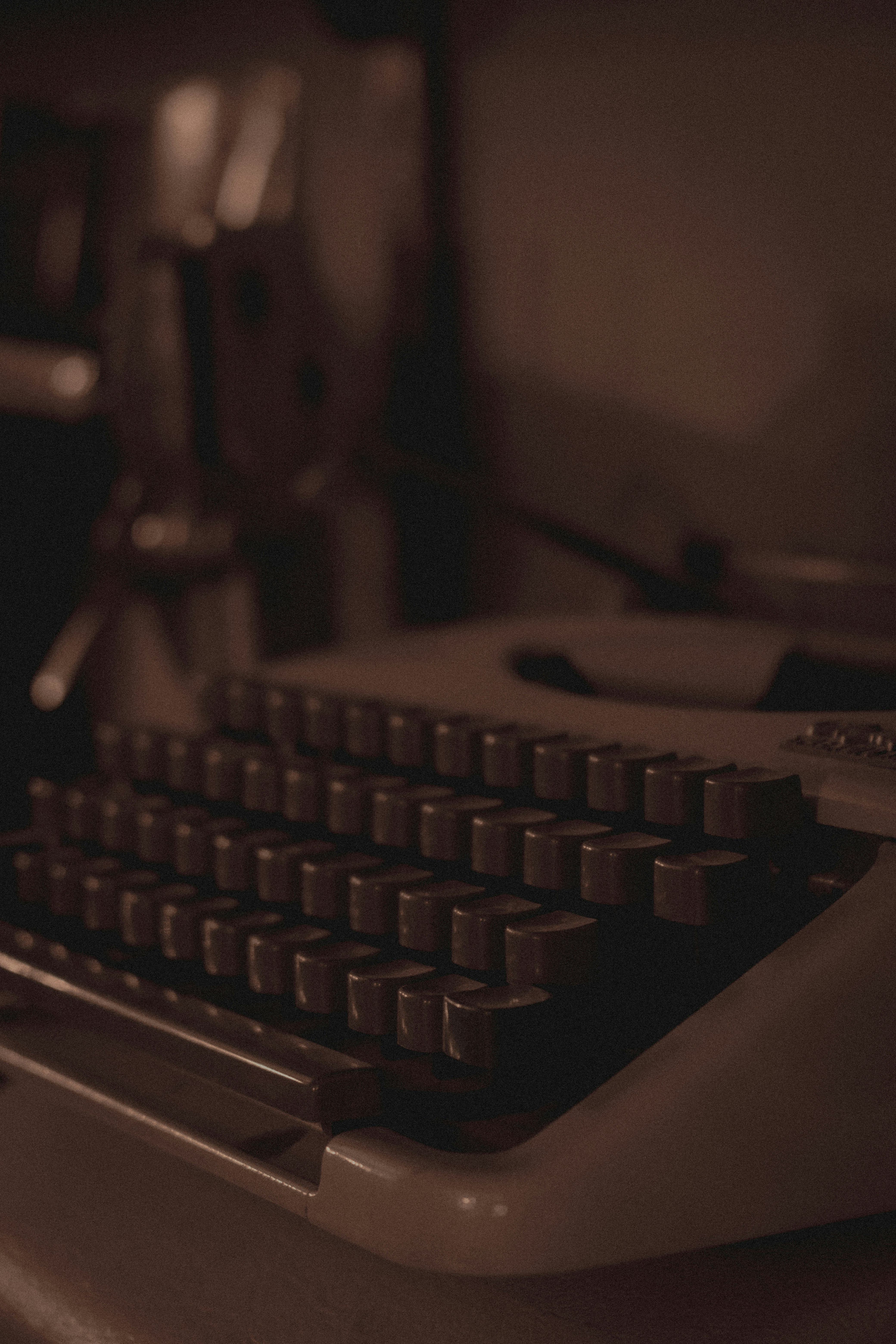 Low-Light Reverie: The Vintage Typewriter in Sepia Glow