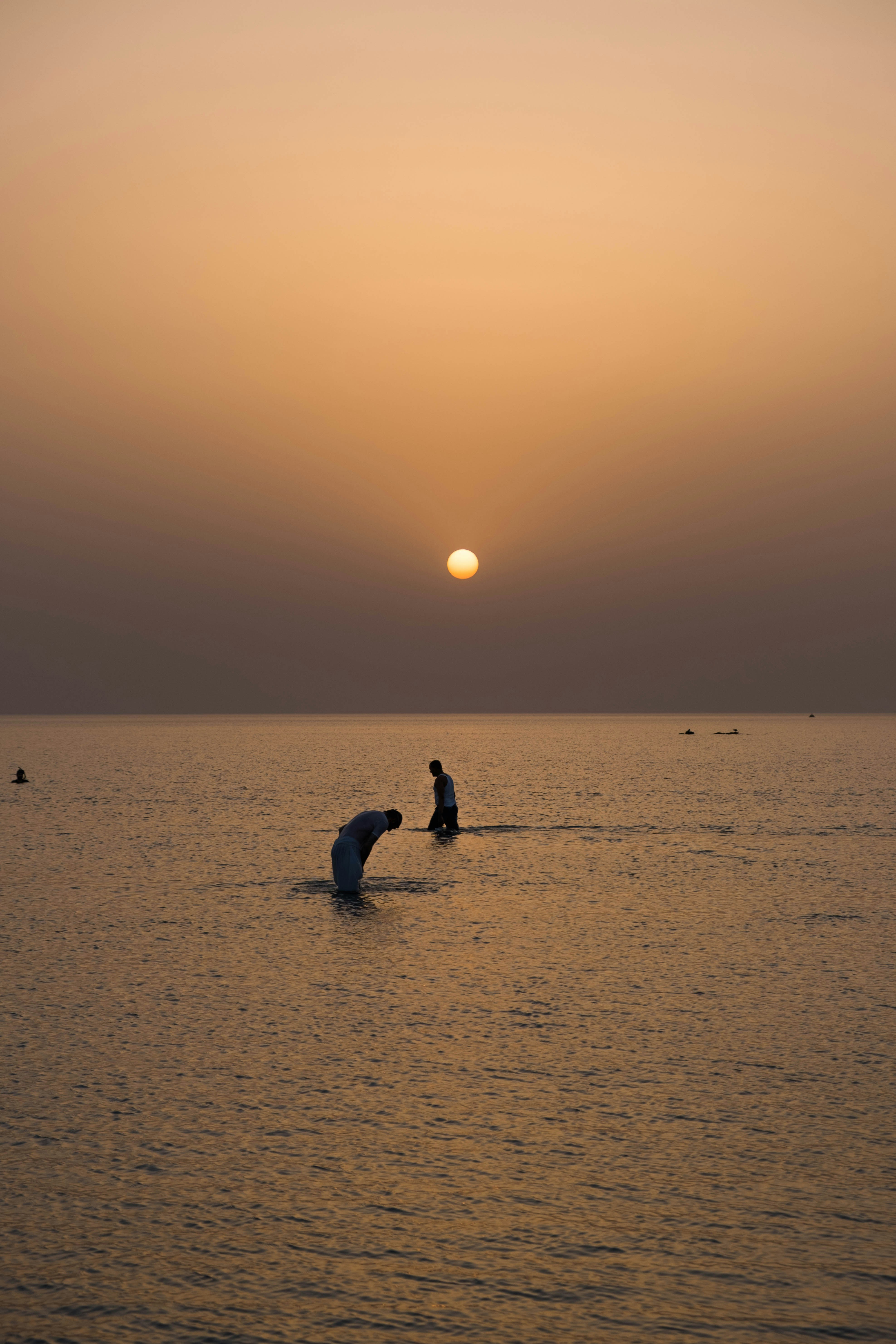 Two Silhouettes at Dusk: A Quiet Golden Sea