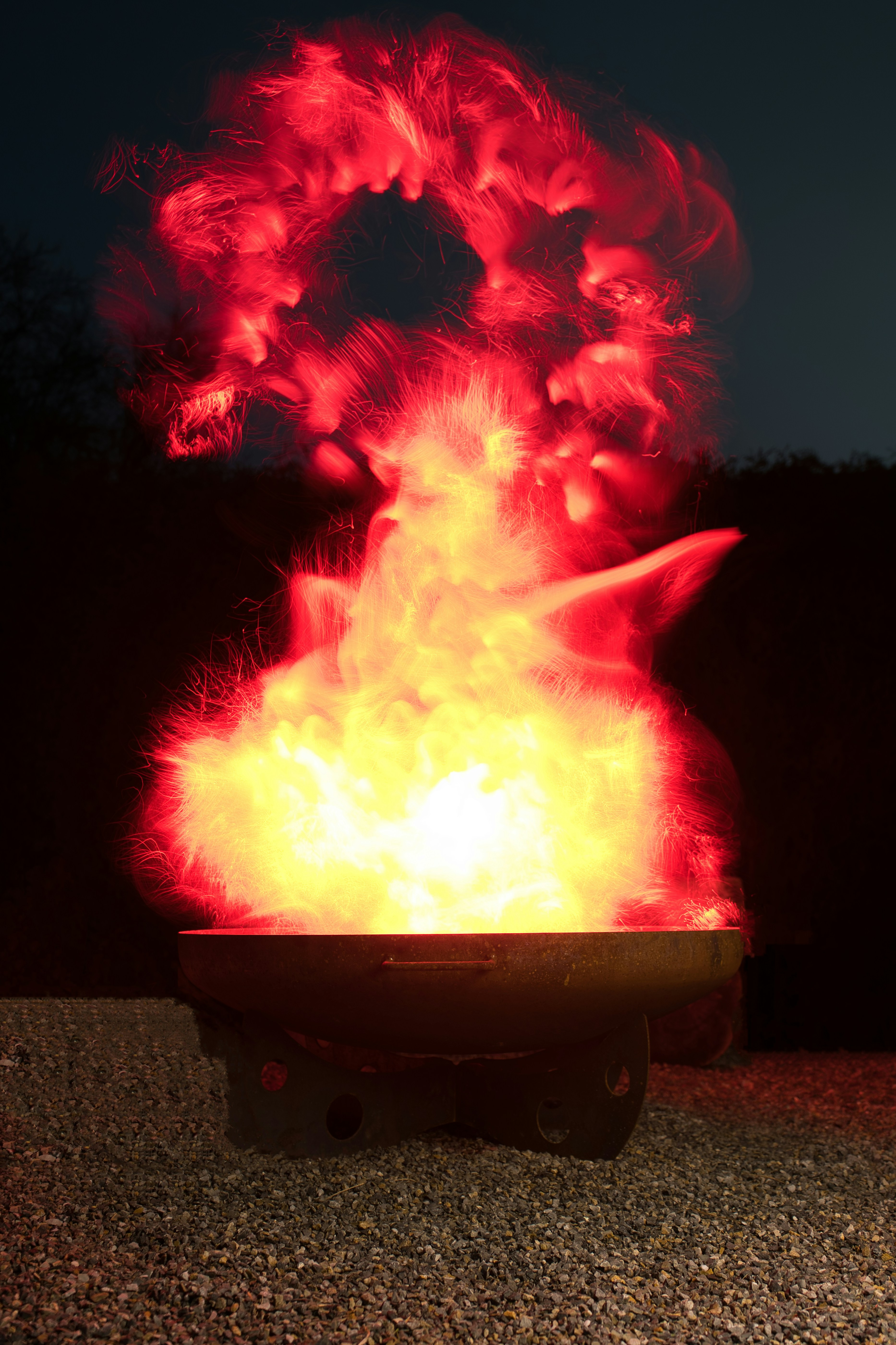 Igniting Night: A Portable Bonfire Roars in the Dark
