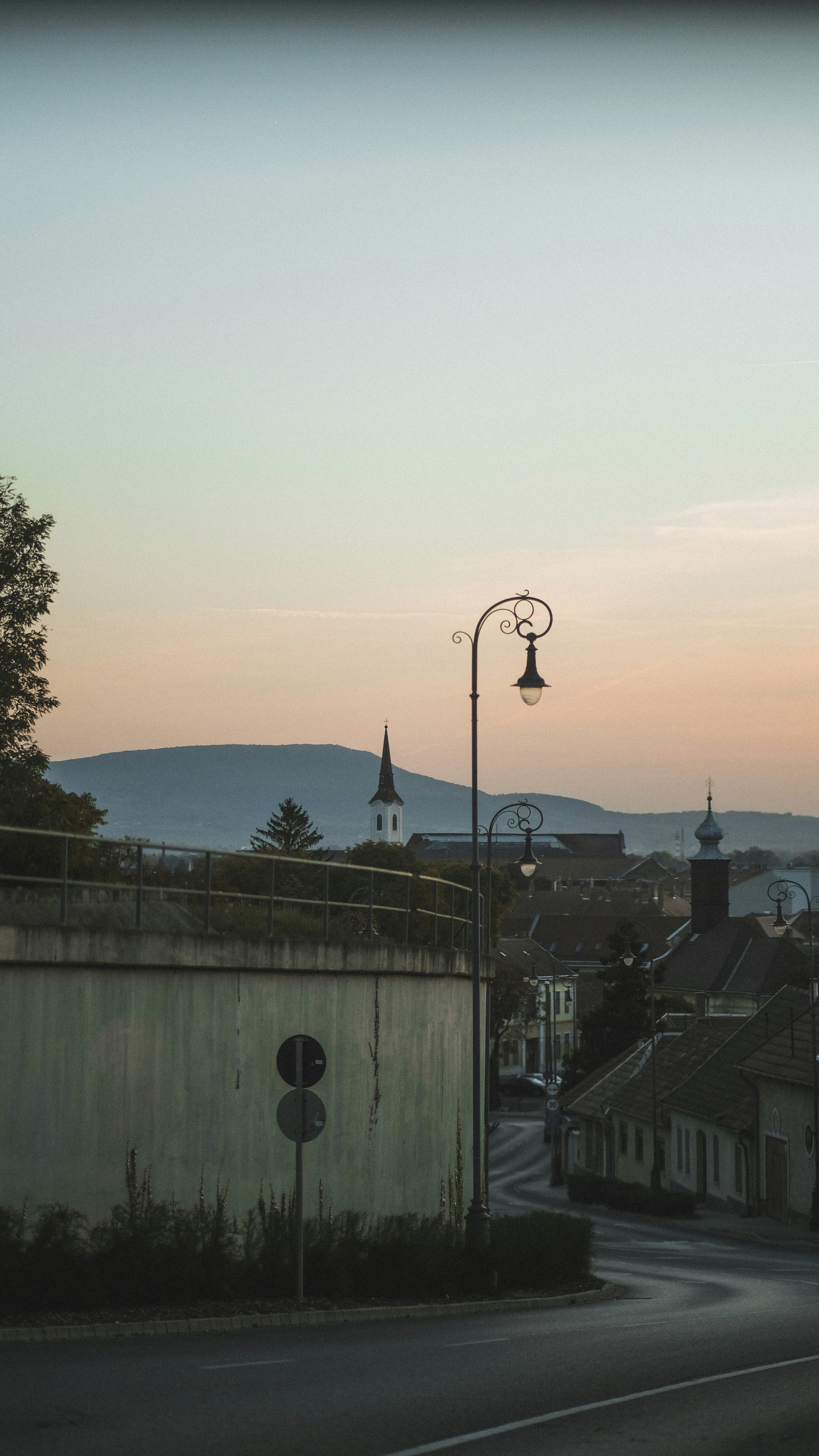 A city street with a clock tower in the distance photo – Free Roadtrip ...