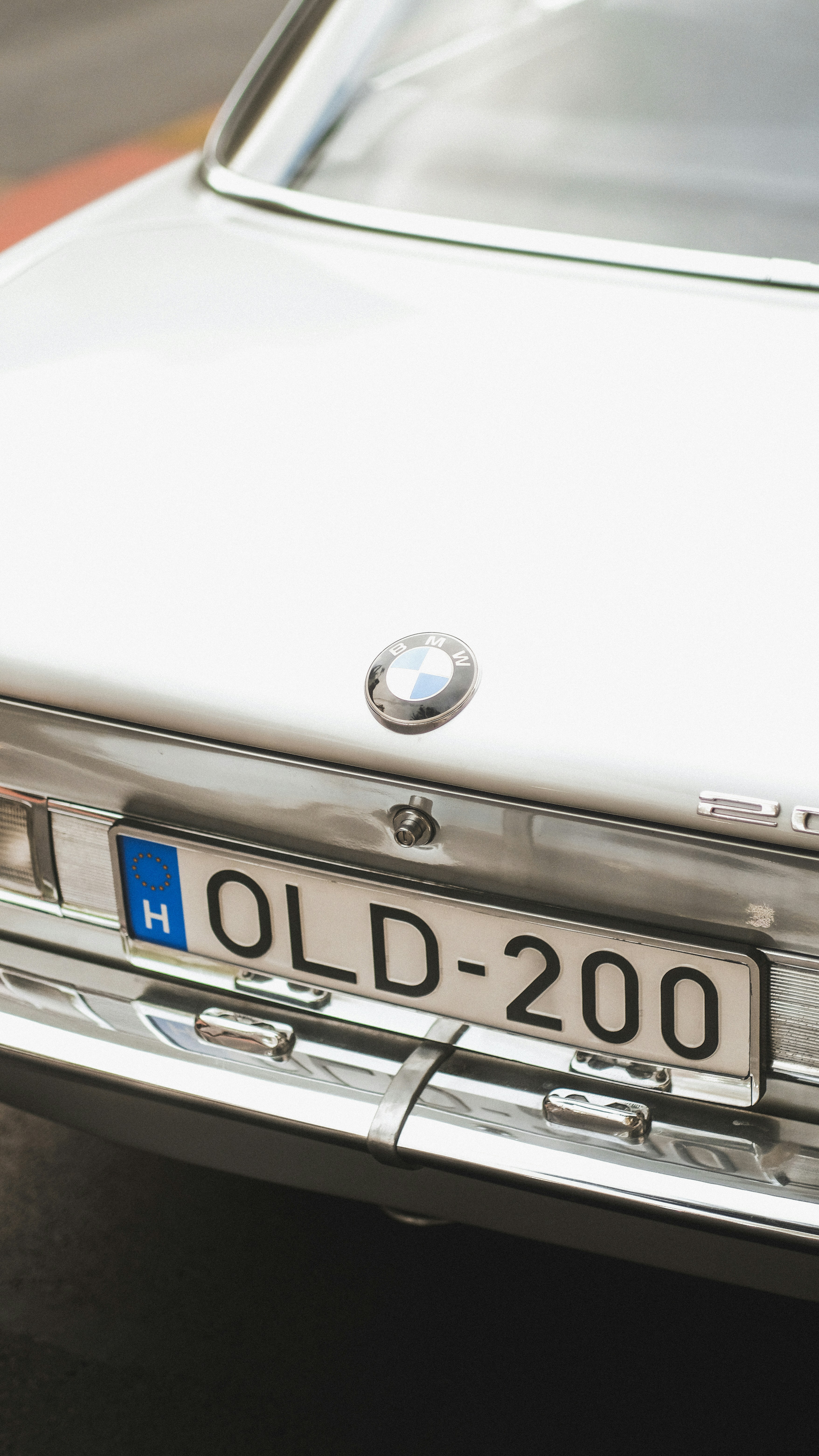 A close up of a white car with a license plate photo – Free Car Image ...