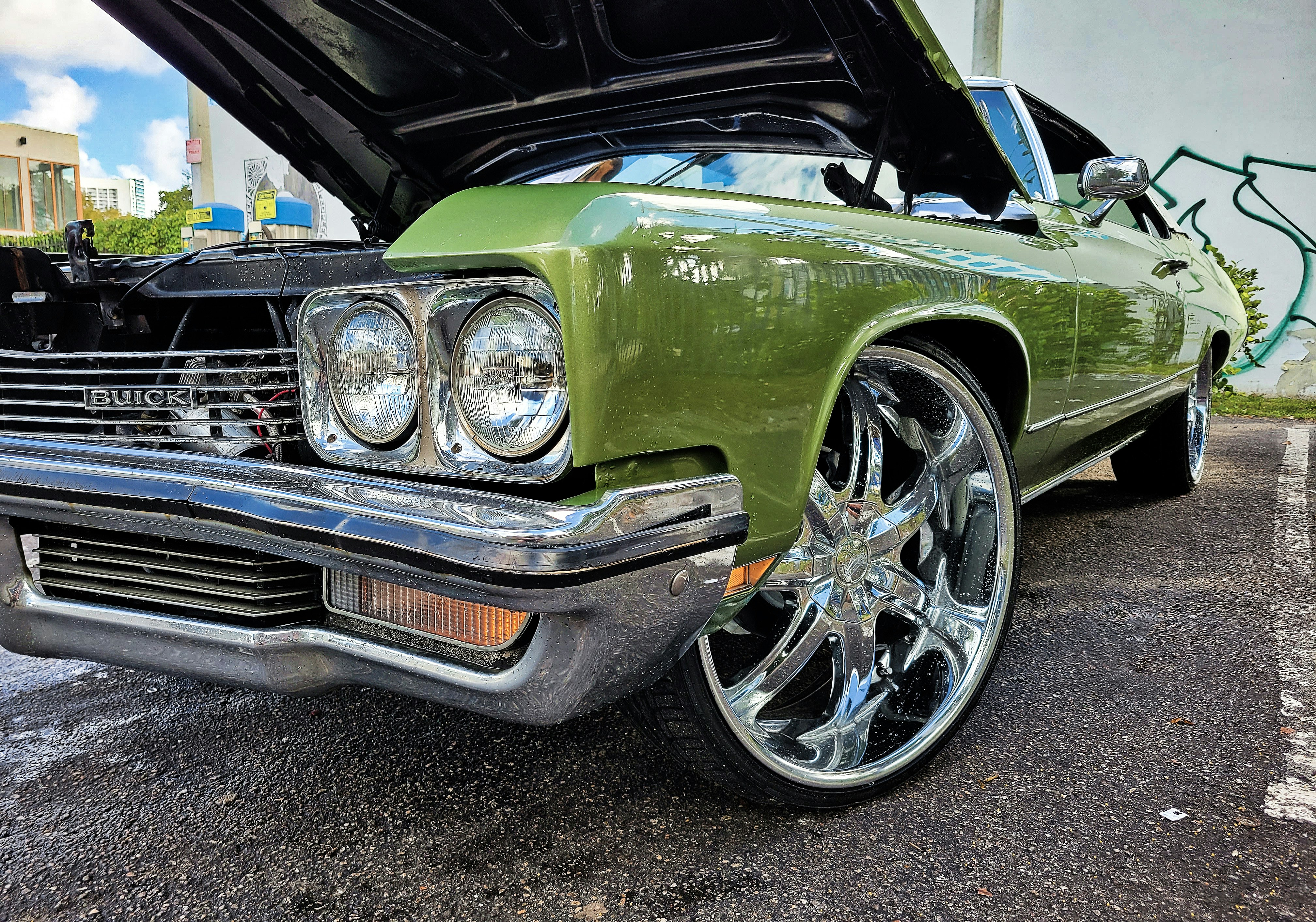 Emerald Buick Under the Open Hood: Chrome Meets Muscle