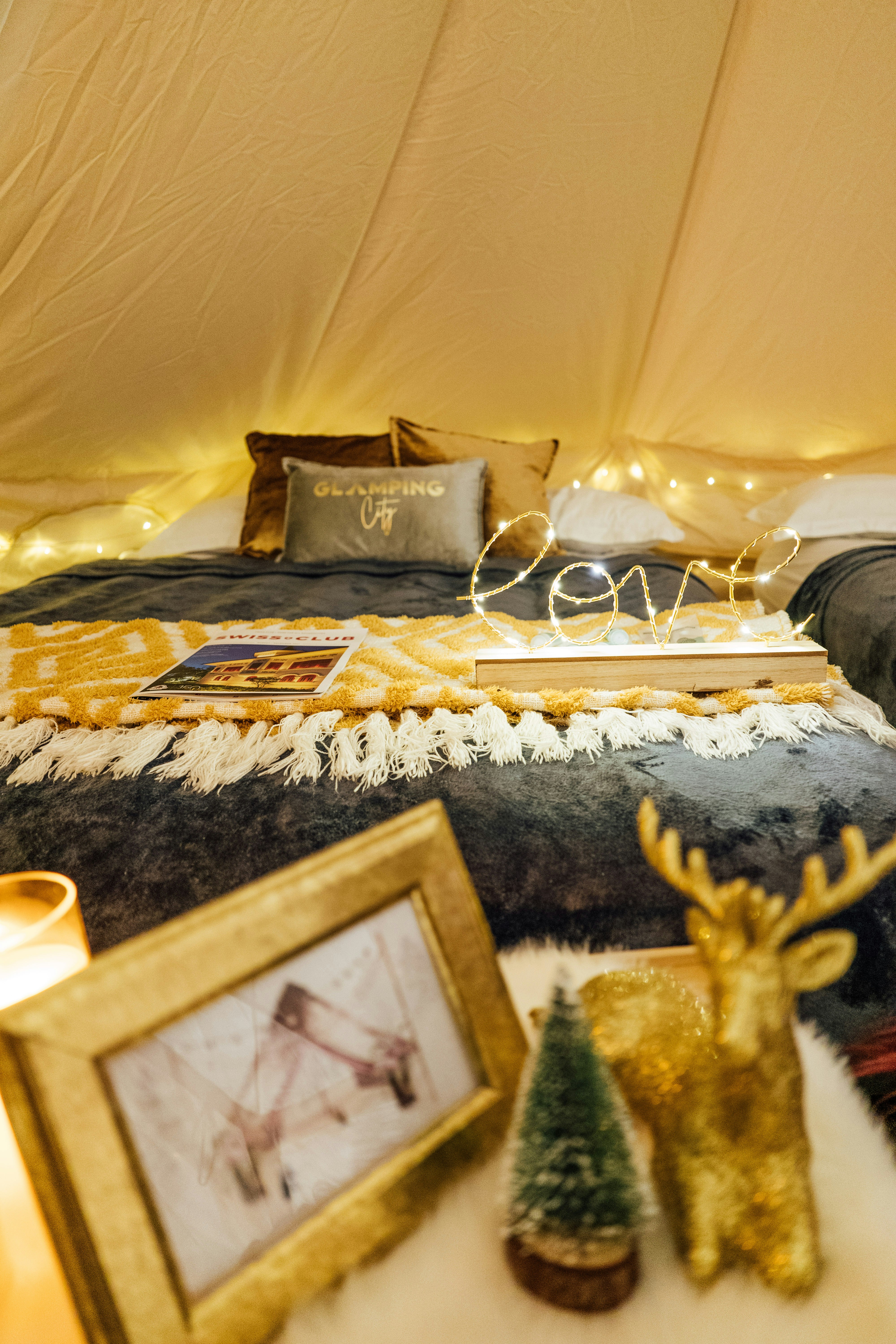 Fairy-Lit Comfort: Velvet Bedside Scene Framed by Warm Glow and Delicate Decor