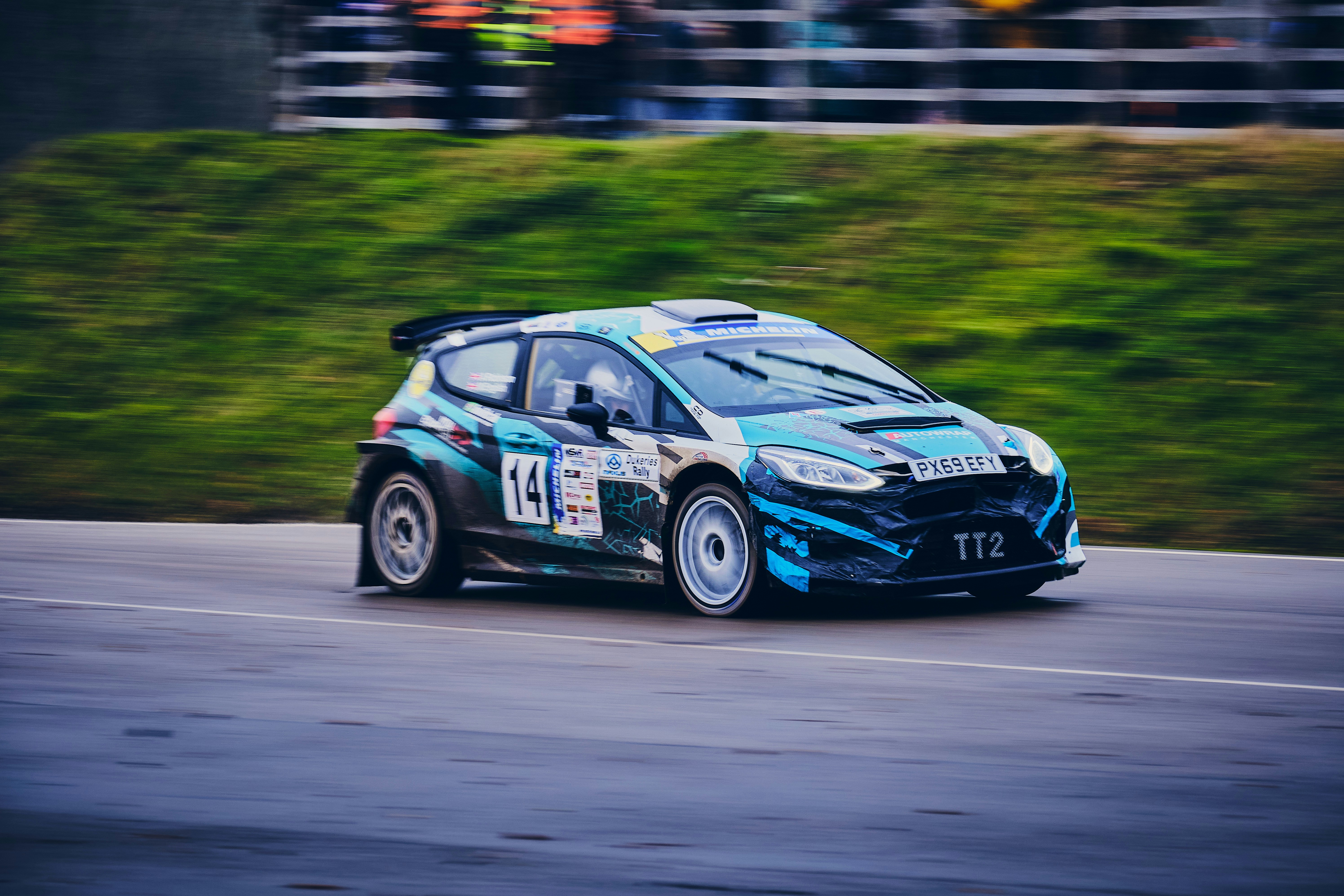 A car driving down a road with a number on it photo – Free Donnington ...