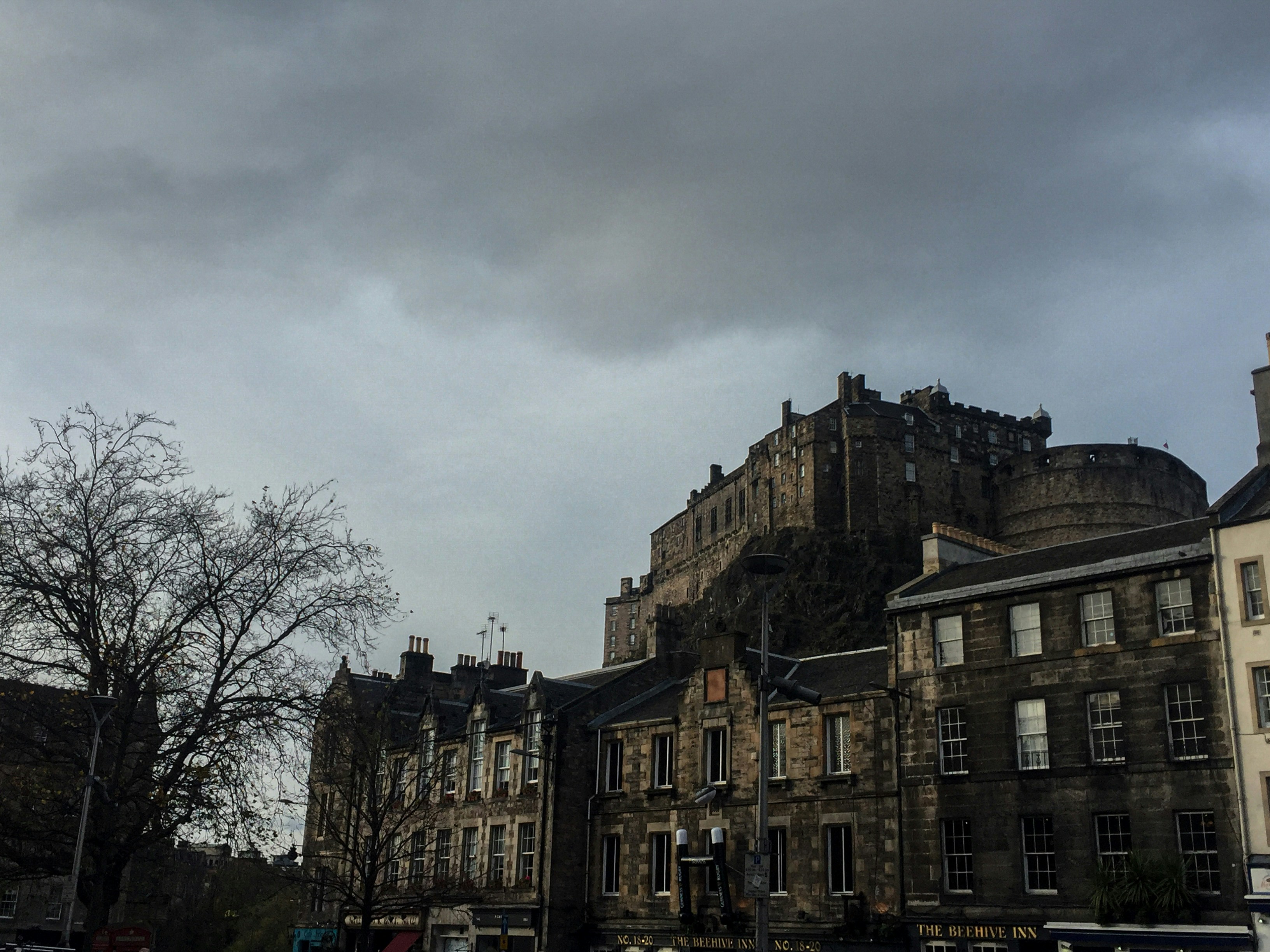 Edinburgh castle  | a large castle like building on a cloudy day