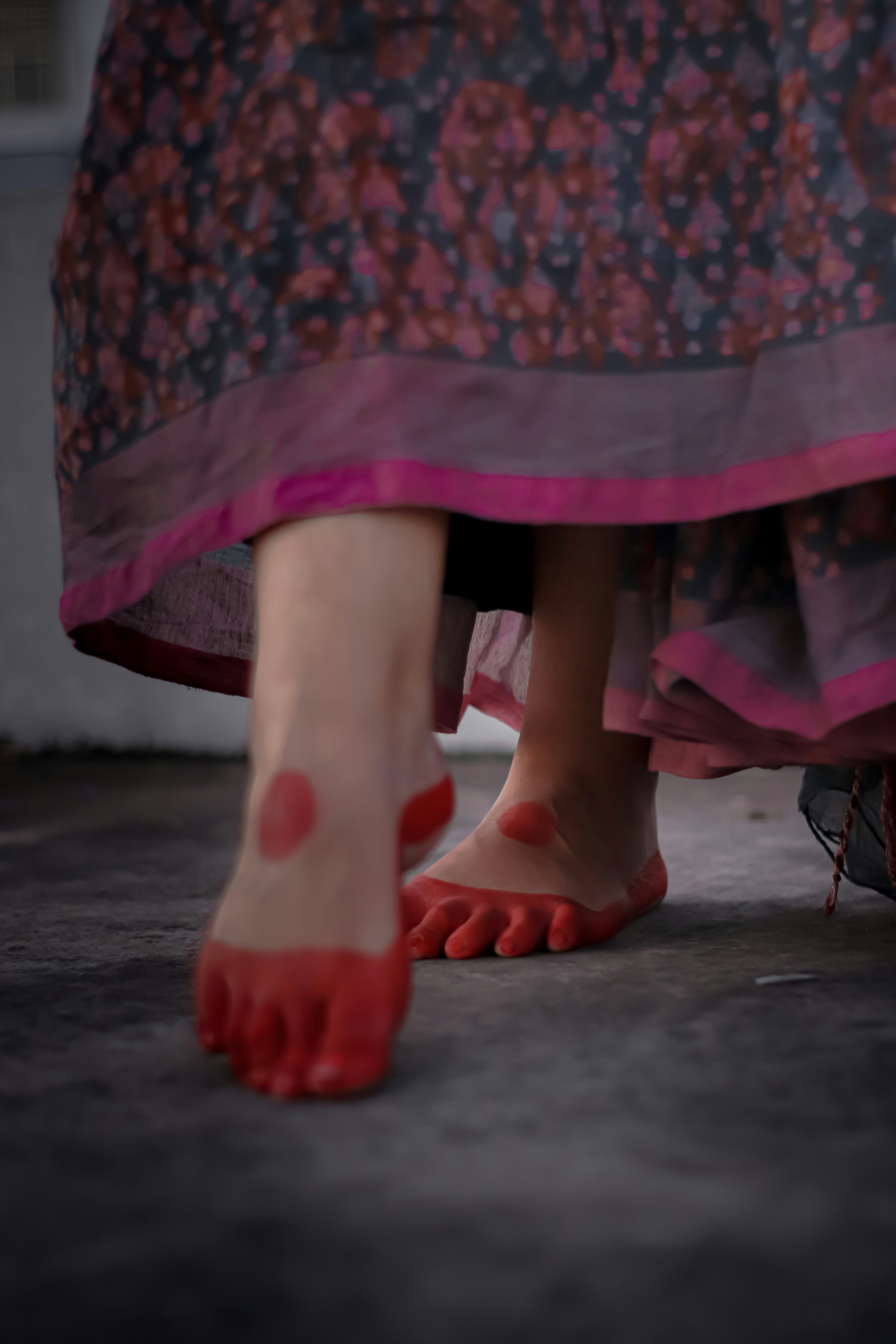 Crimson Soles Under a Floral Hem