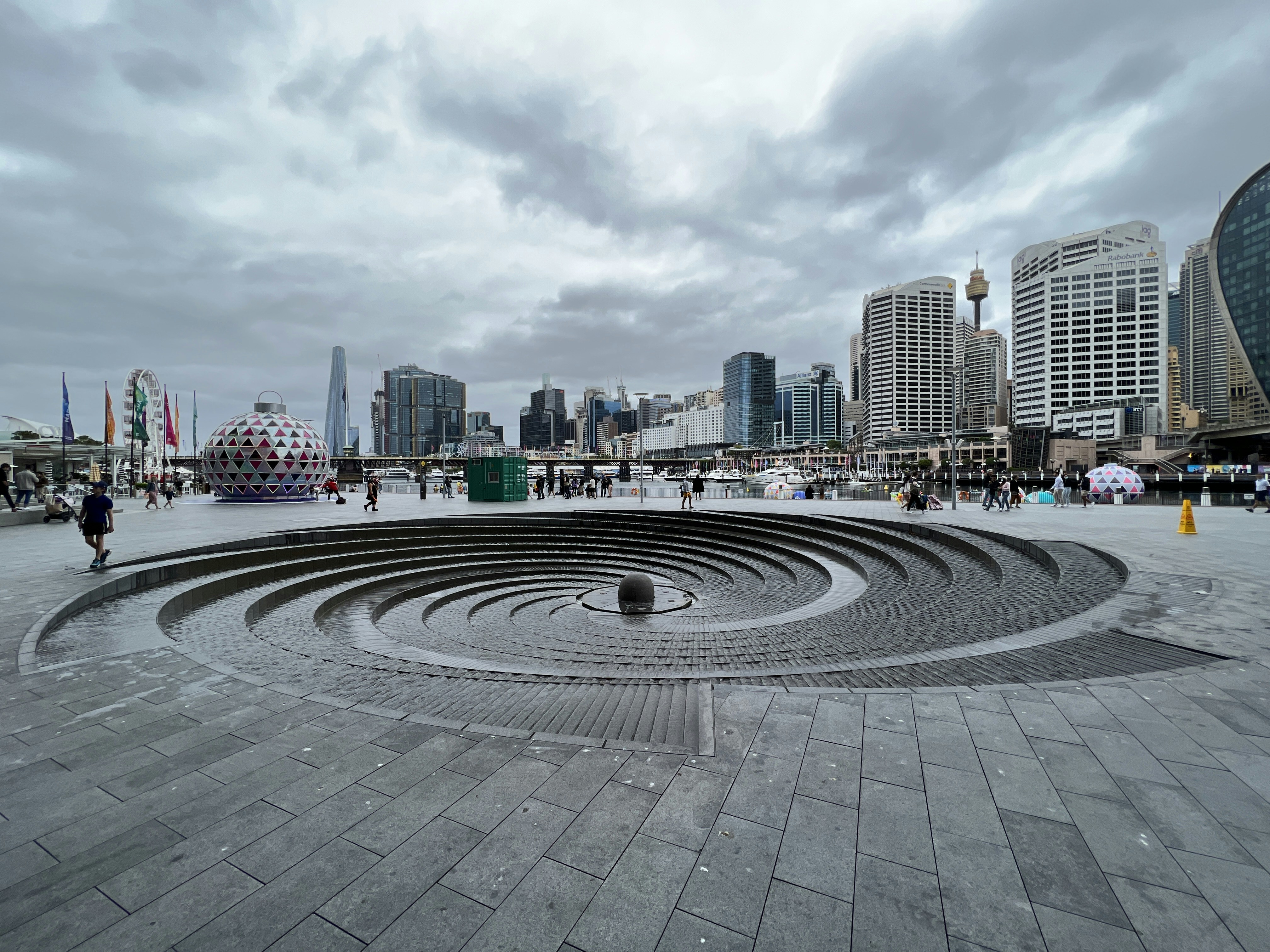 A large circular structure in the middle of a plaza photo – Free ...