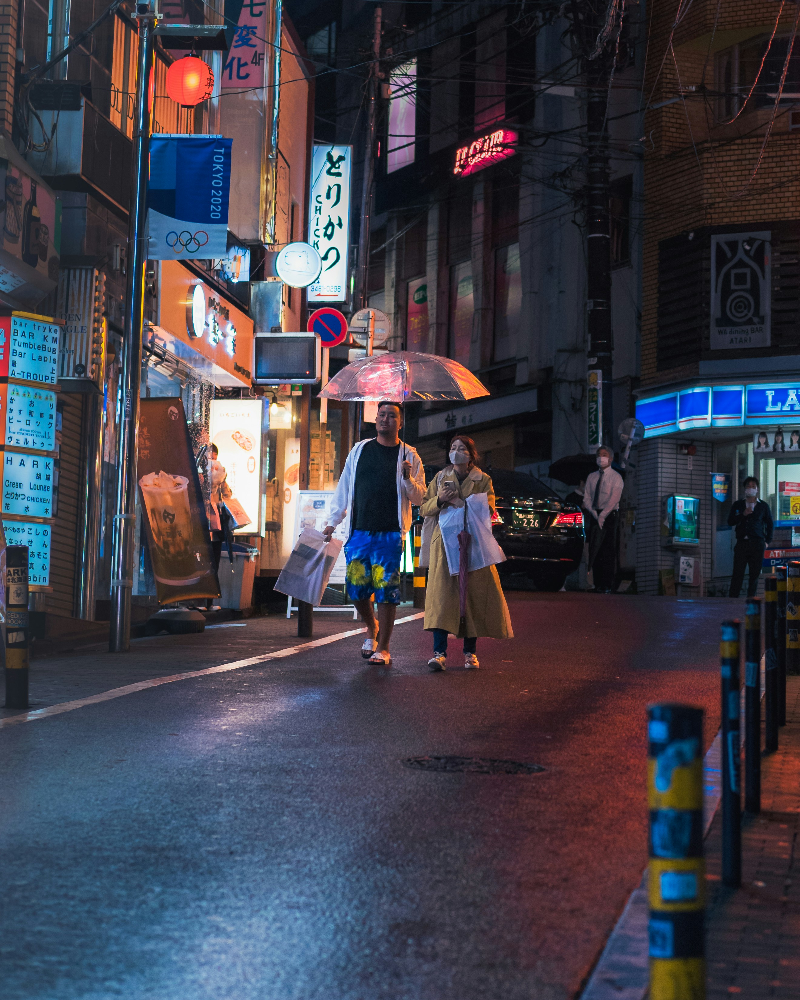Rainy Night Stroll Through Neon-Lit Streets