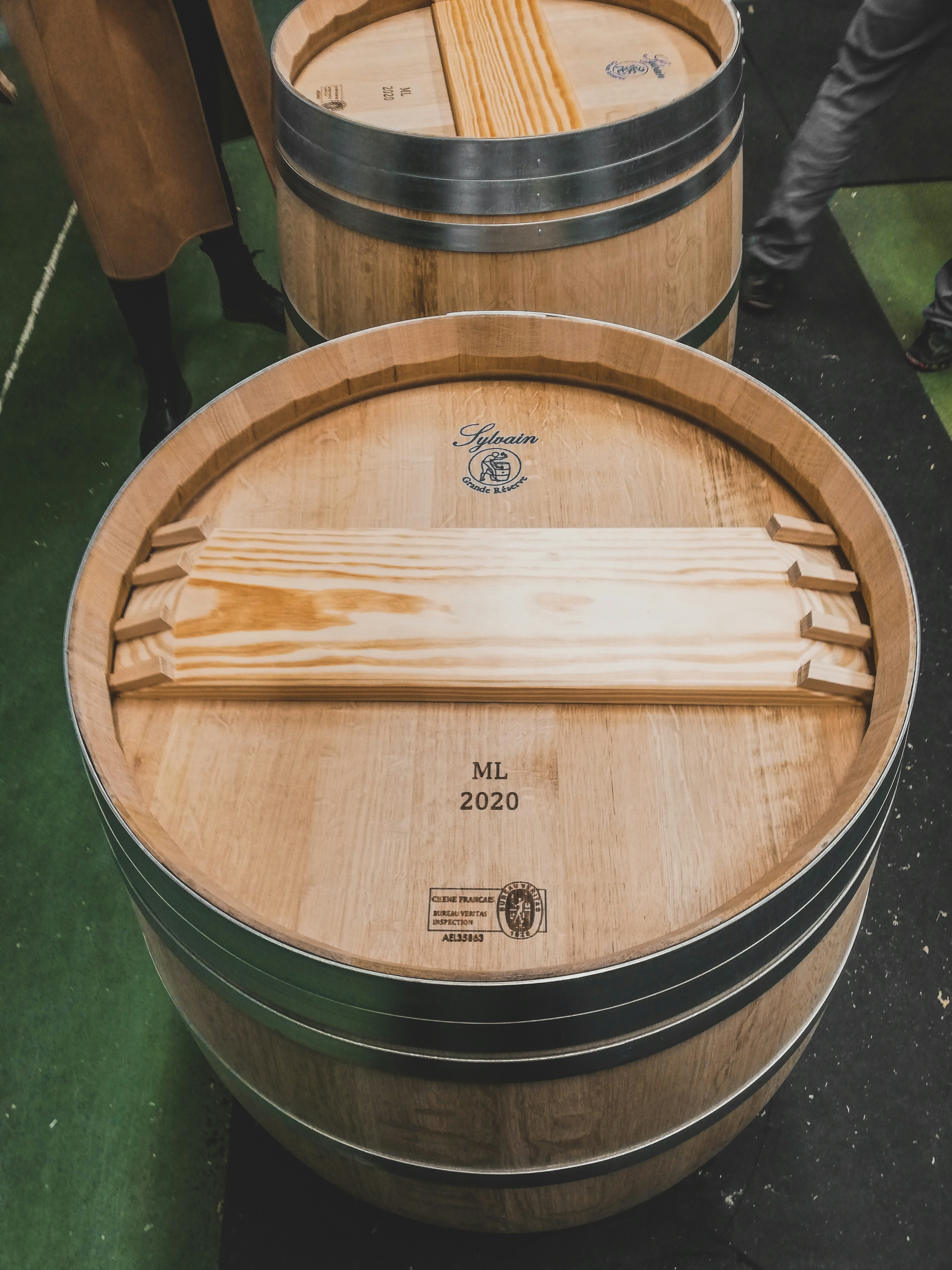 a couple of wooden barrels sitting next to each other