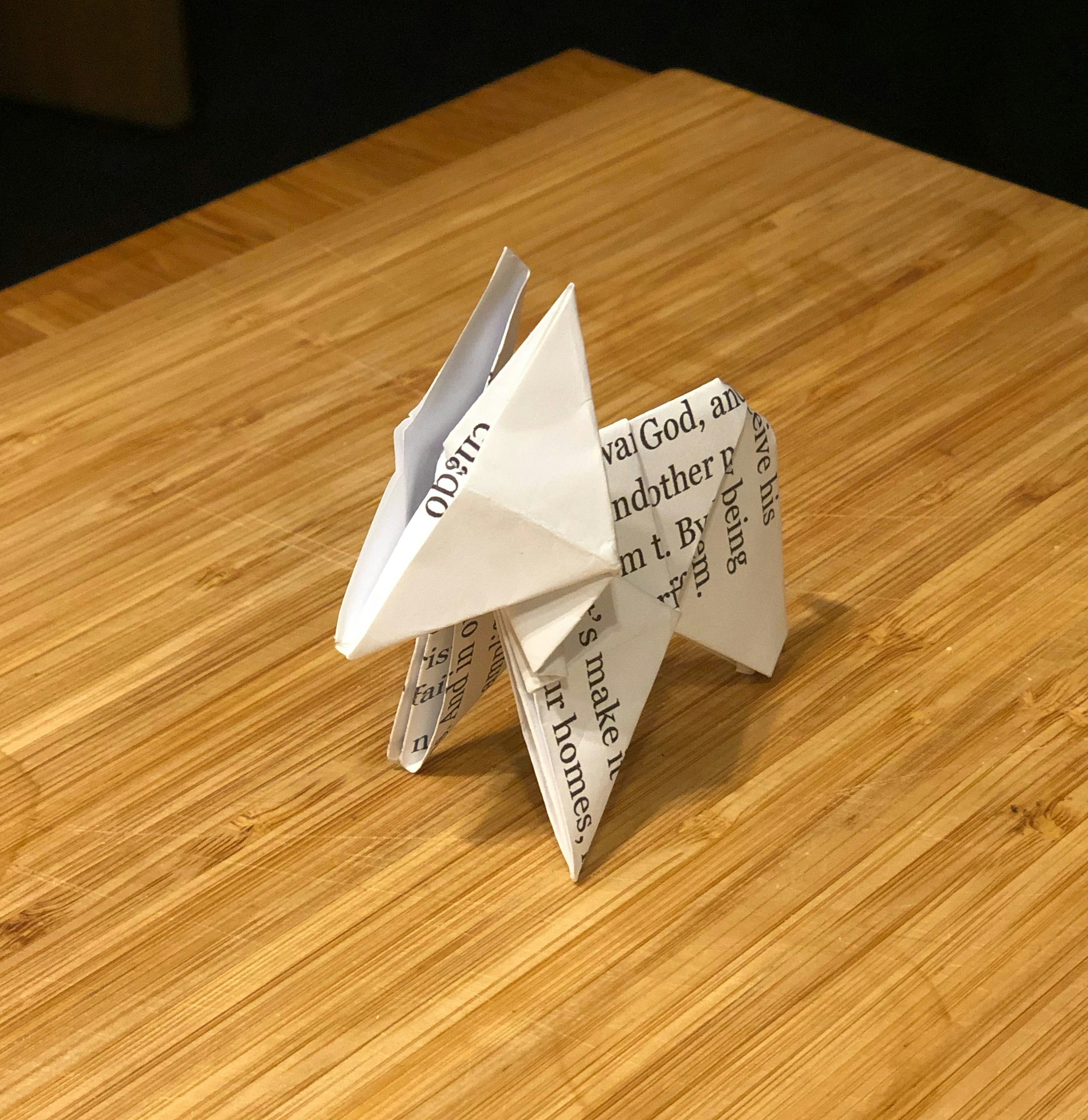 A paper origami origami sculpture on a wooden table photo – Free ...