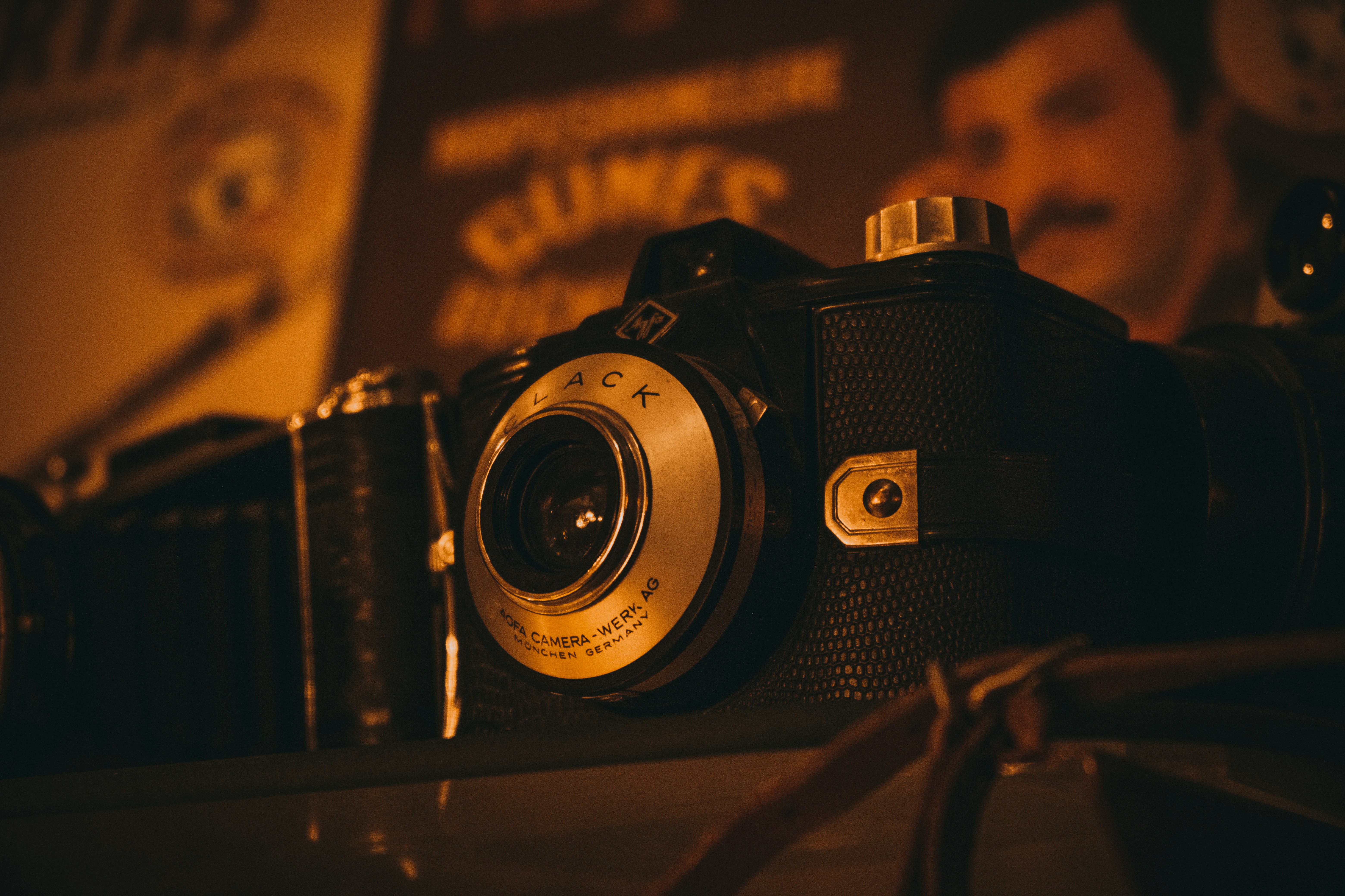 Amber Spotlight on a Vintage SLR: a Quiet Shelf Moment