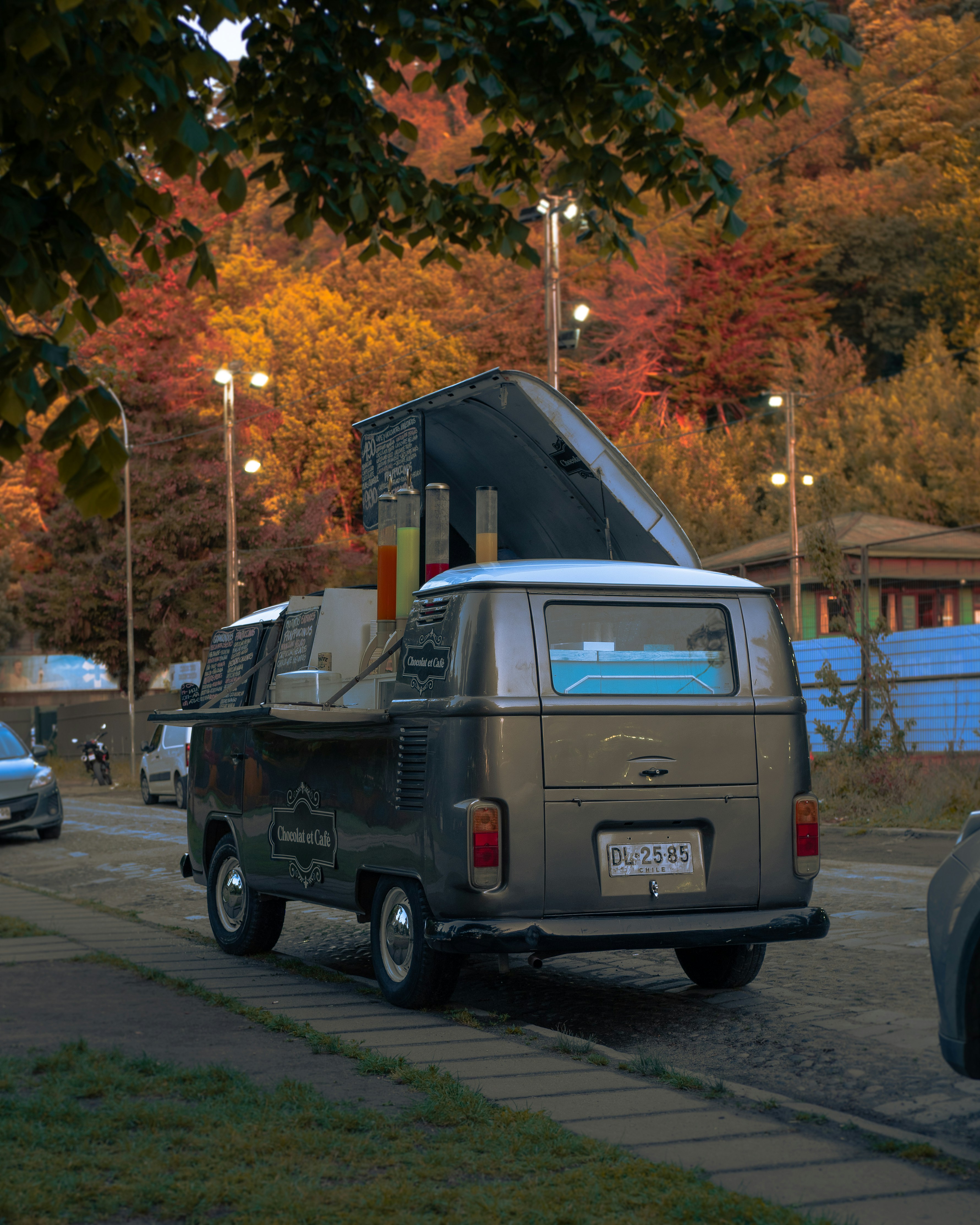Hatch Open, Autumn Glow: A Retro Van Resting Under Fall Light