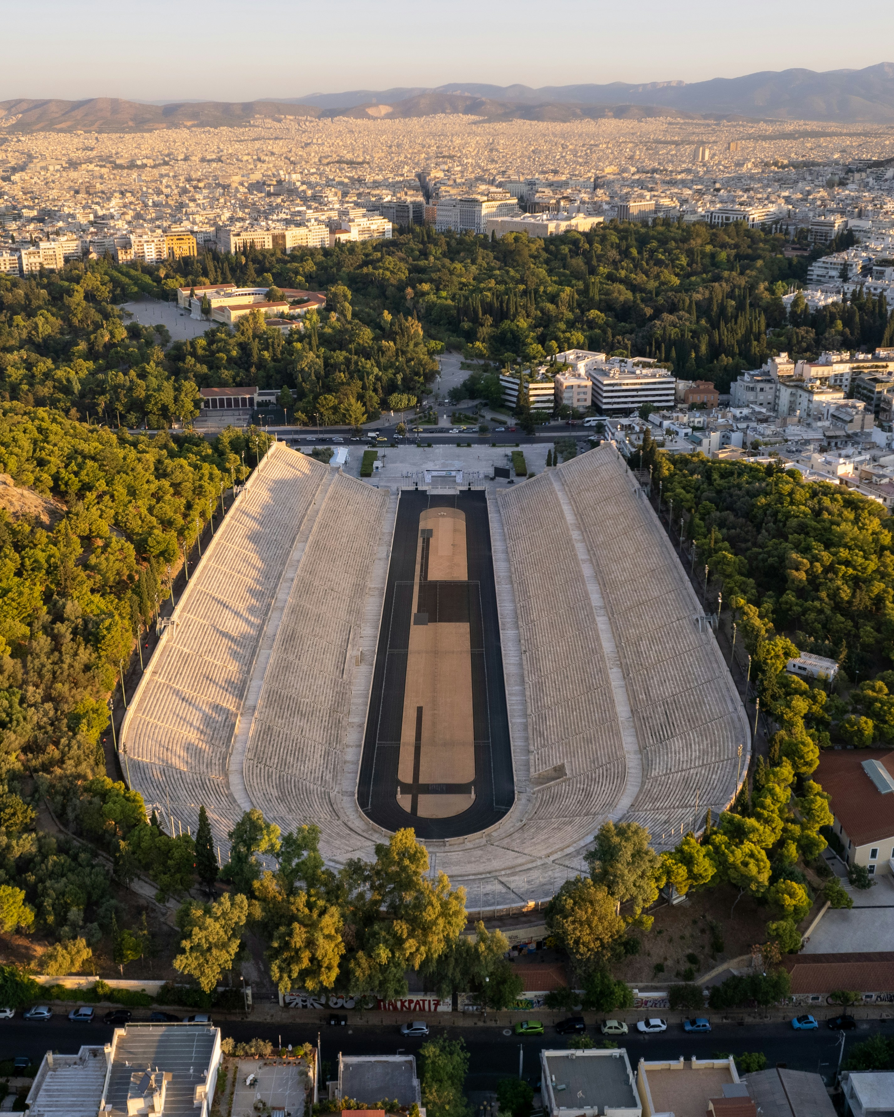 An aerial view of a stadium with trees surrounding it photo – Free ...