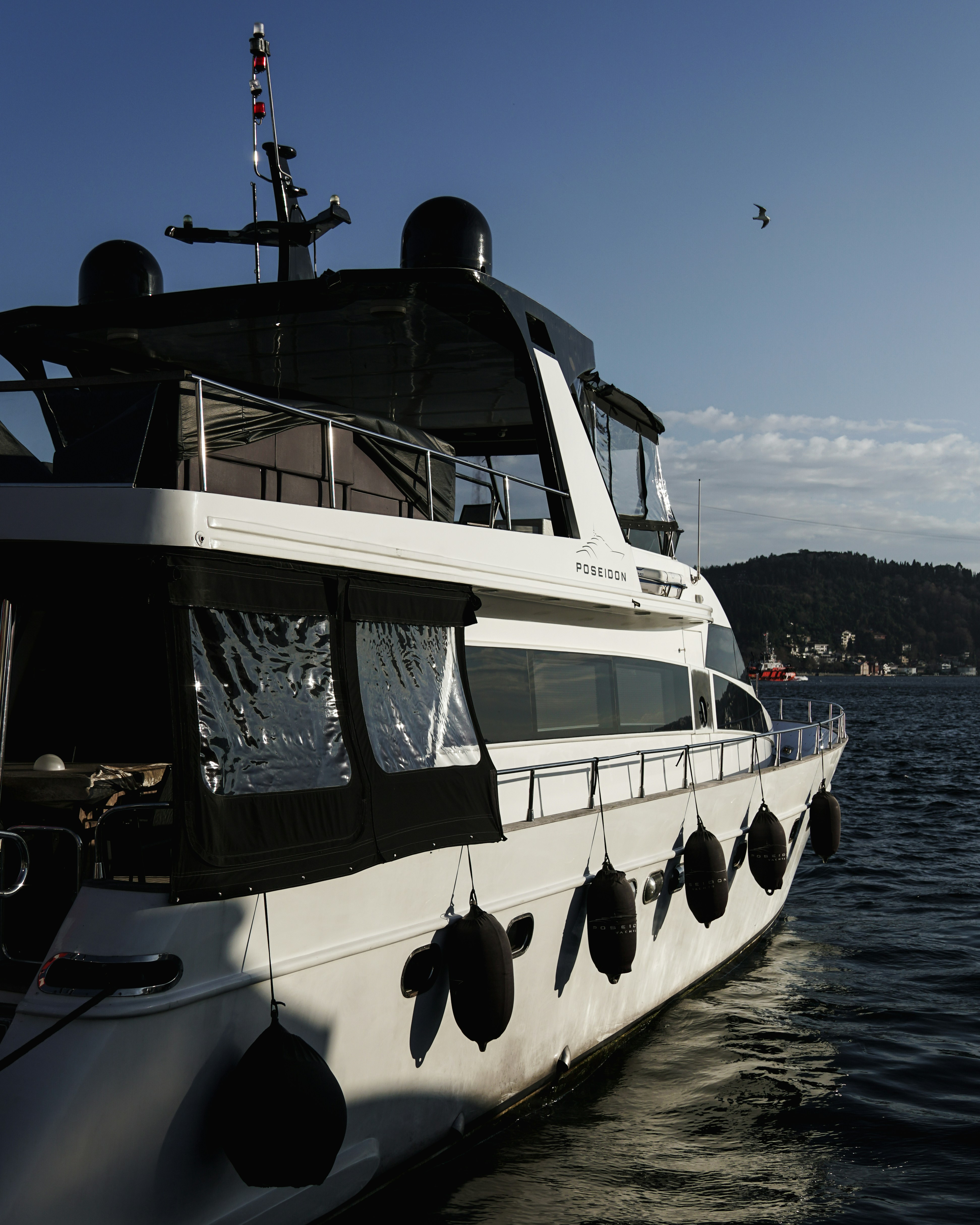 Side Profile of a White Luxury Yacht Against Quiet Blue Seas