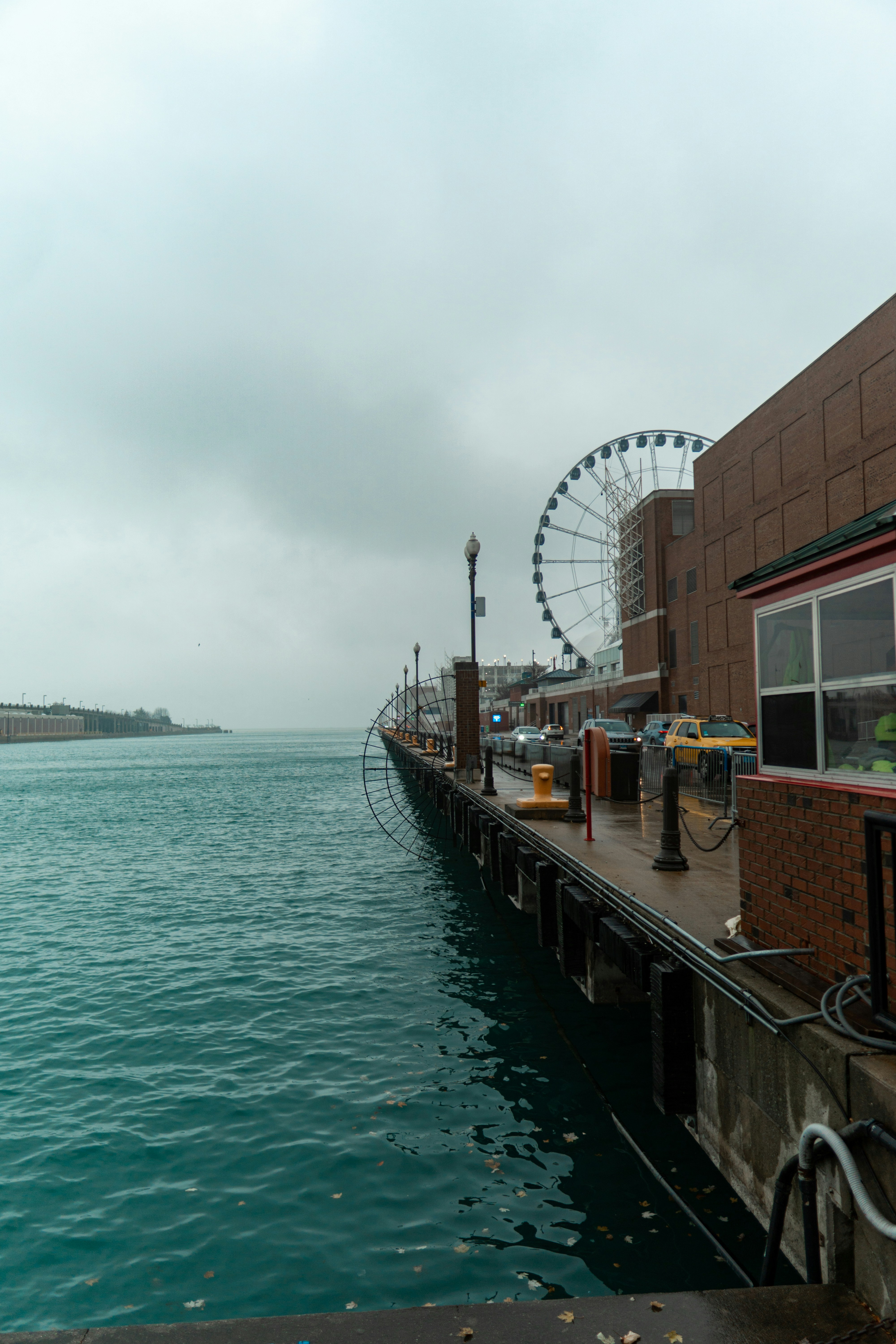 a large body of water next to a pier