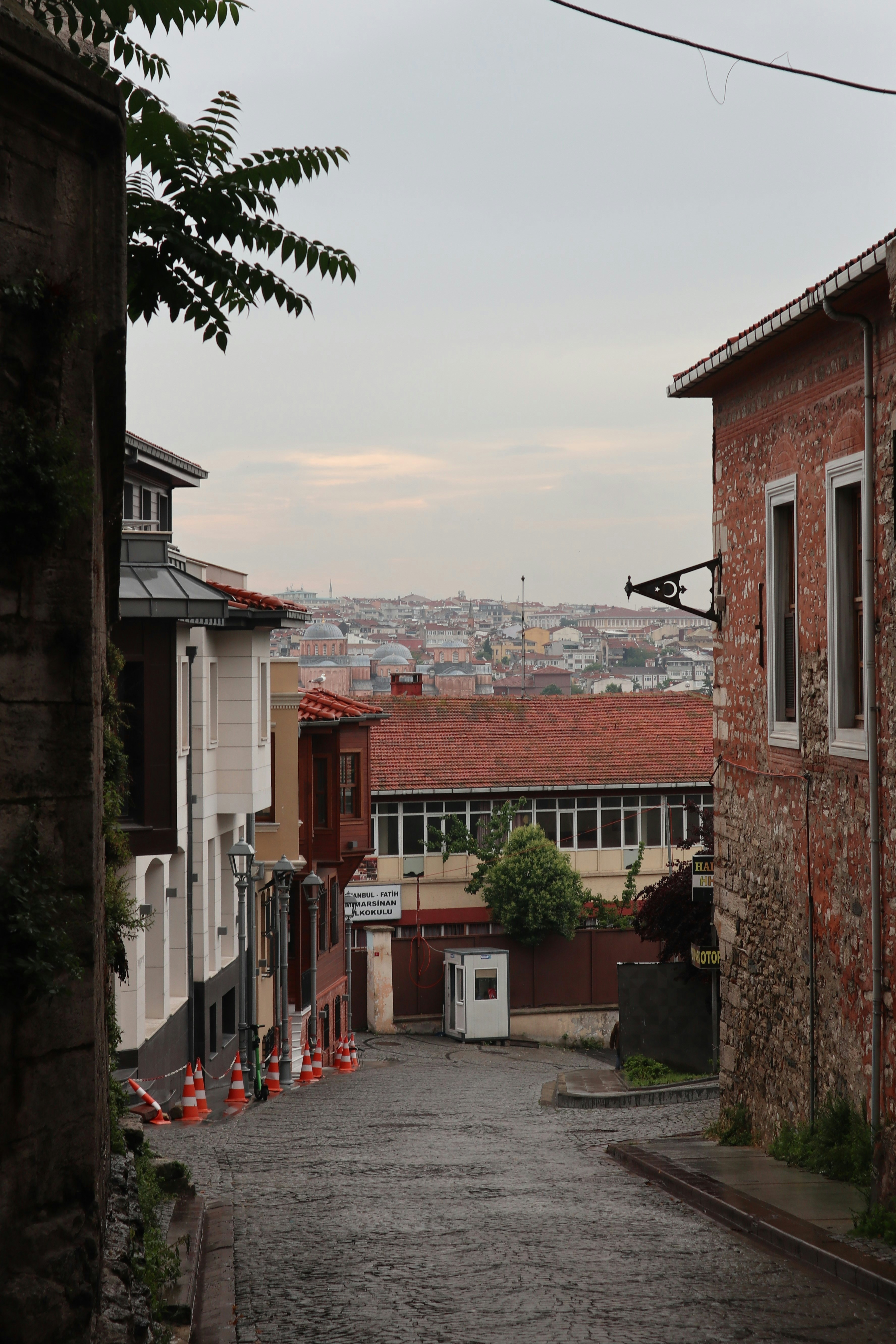 Cobbled Corridor Toward a Distant Cityscape