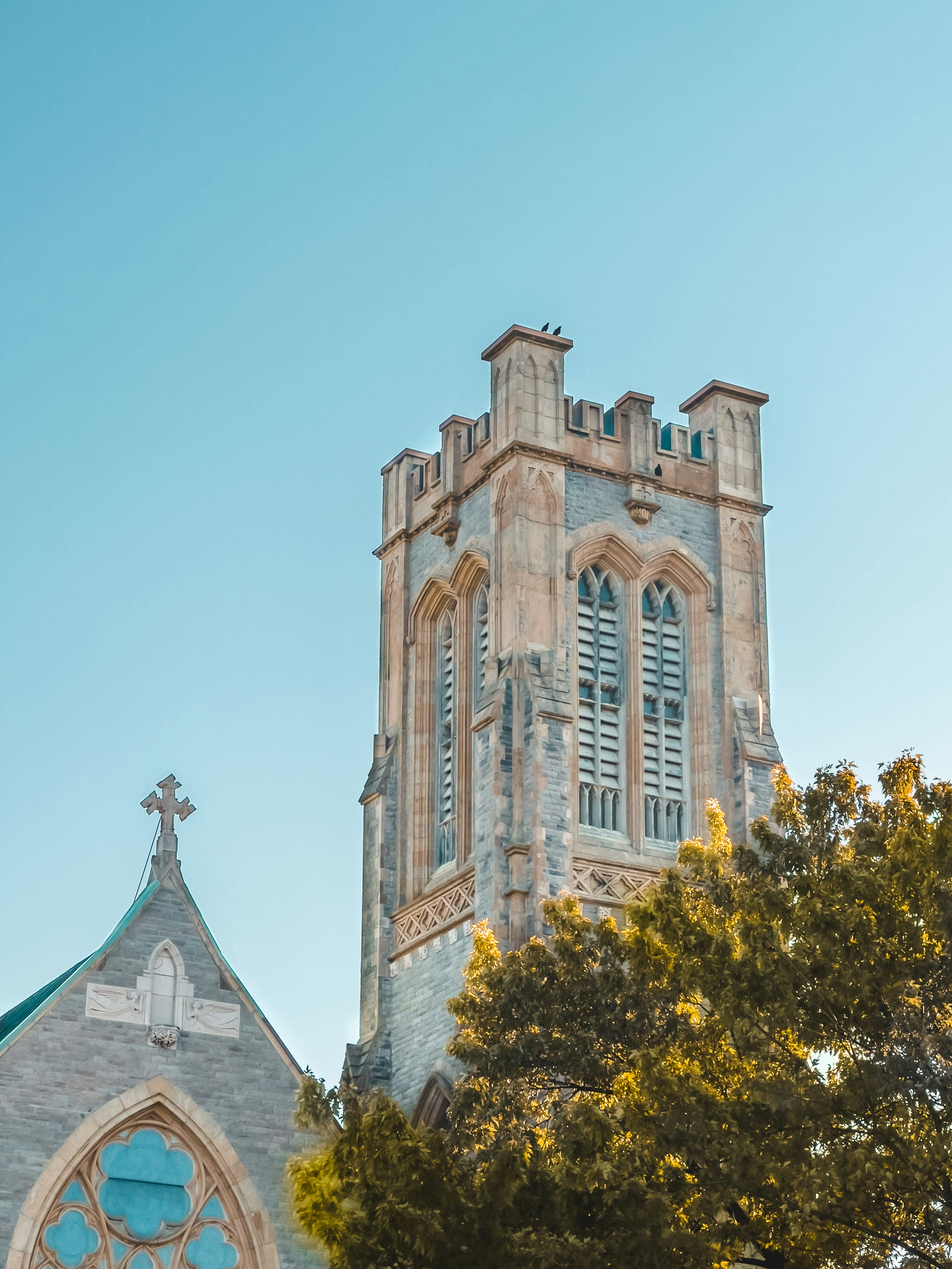 A church steeple with a blue sky in the background photo – Free ...