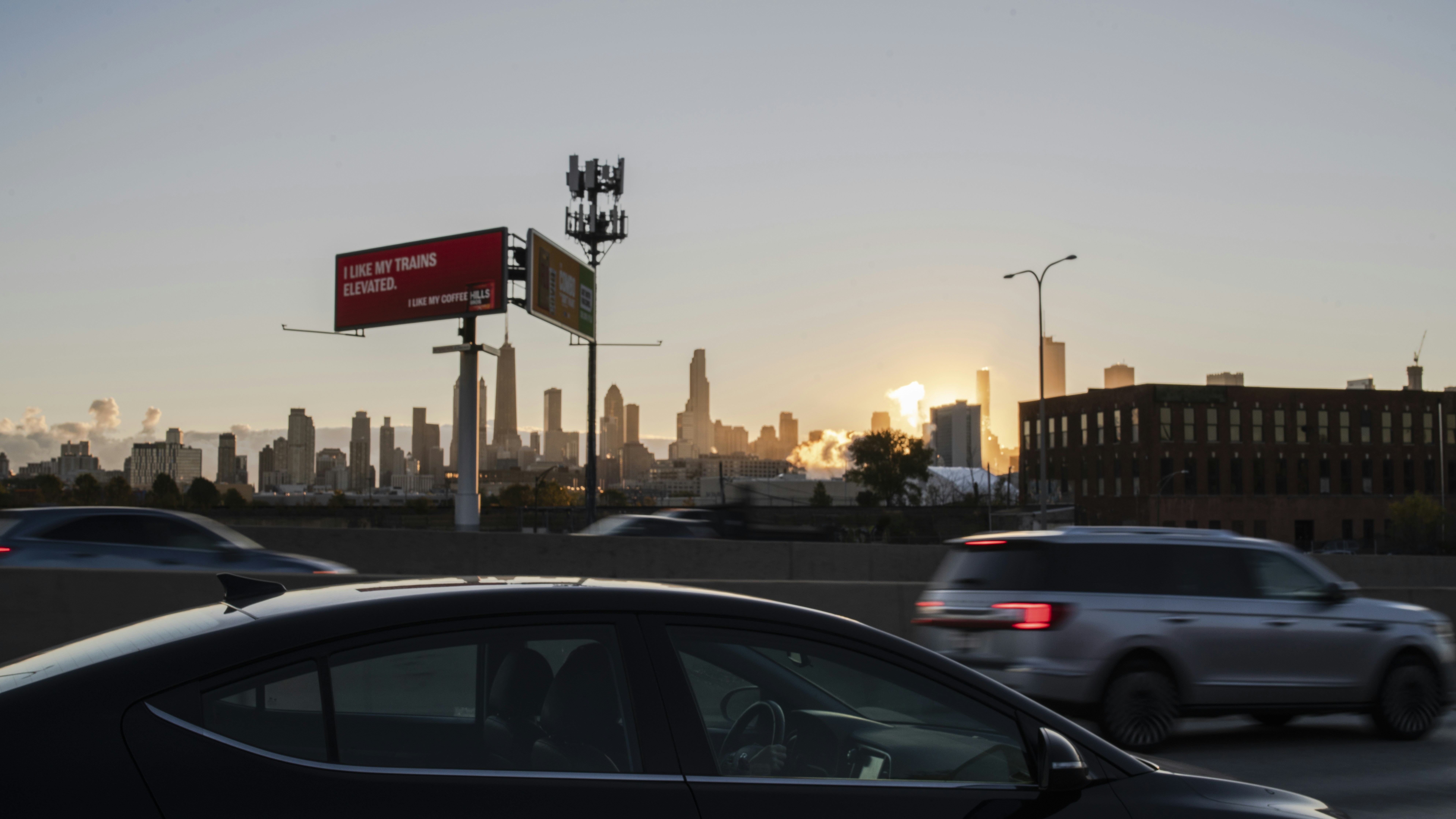 Sunset Lumen Over the City: Horizon Glow and Moving Traffic