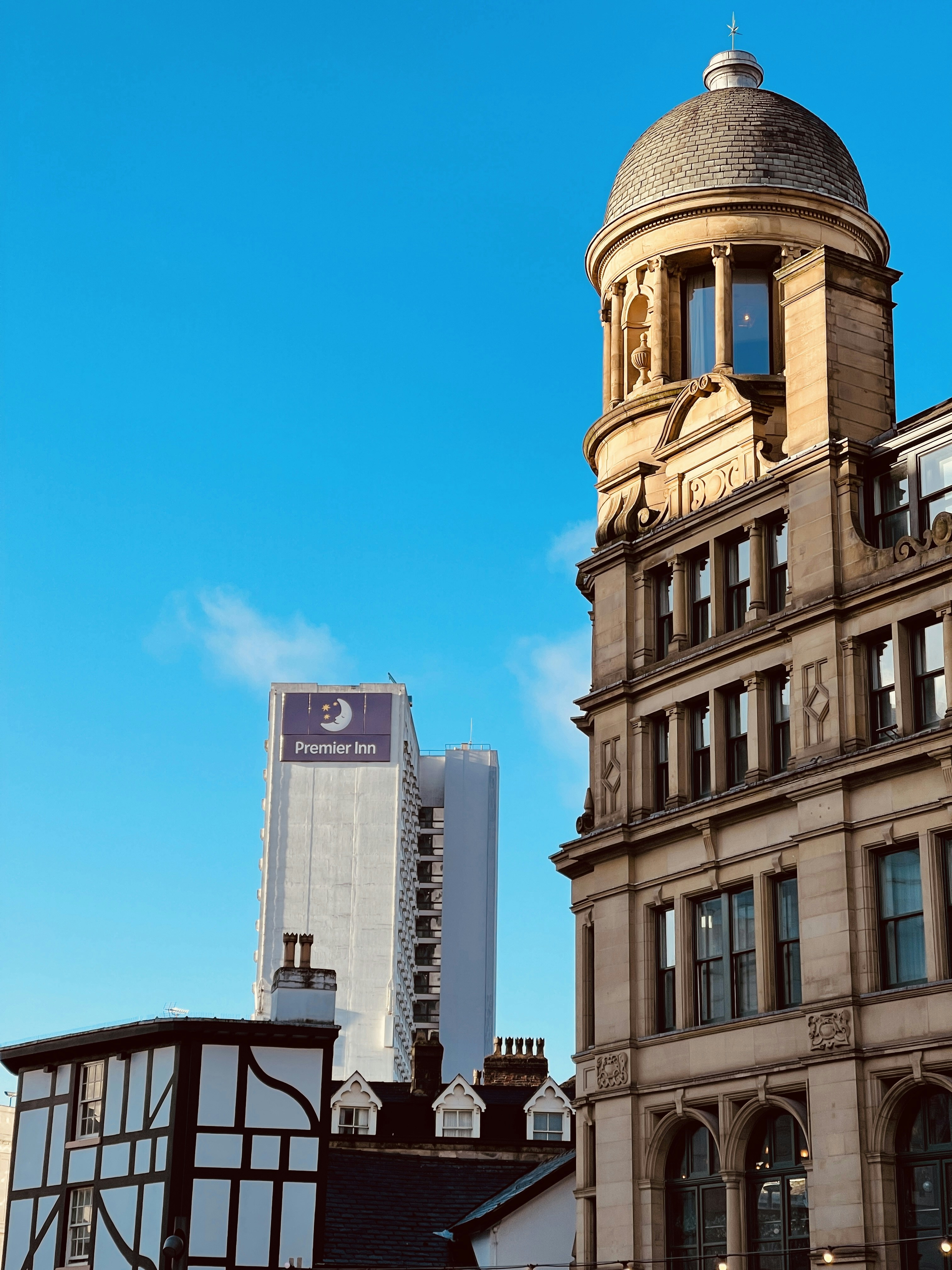 Juxtaposition of Modernity and Tradition Under a Clear Sky