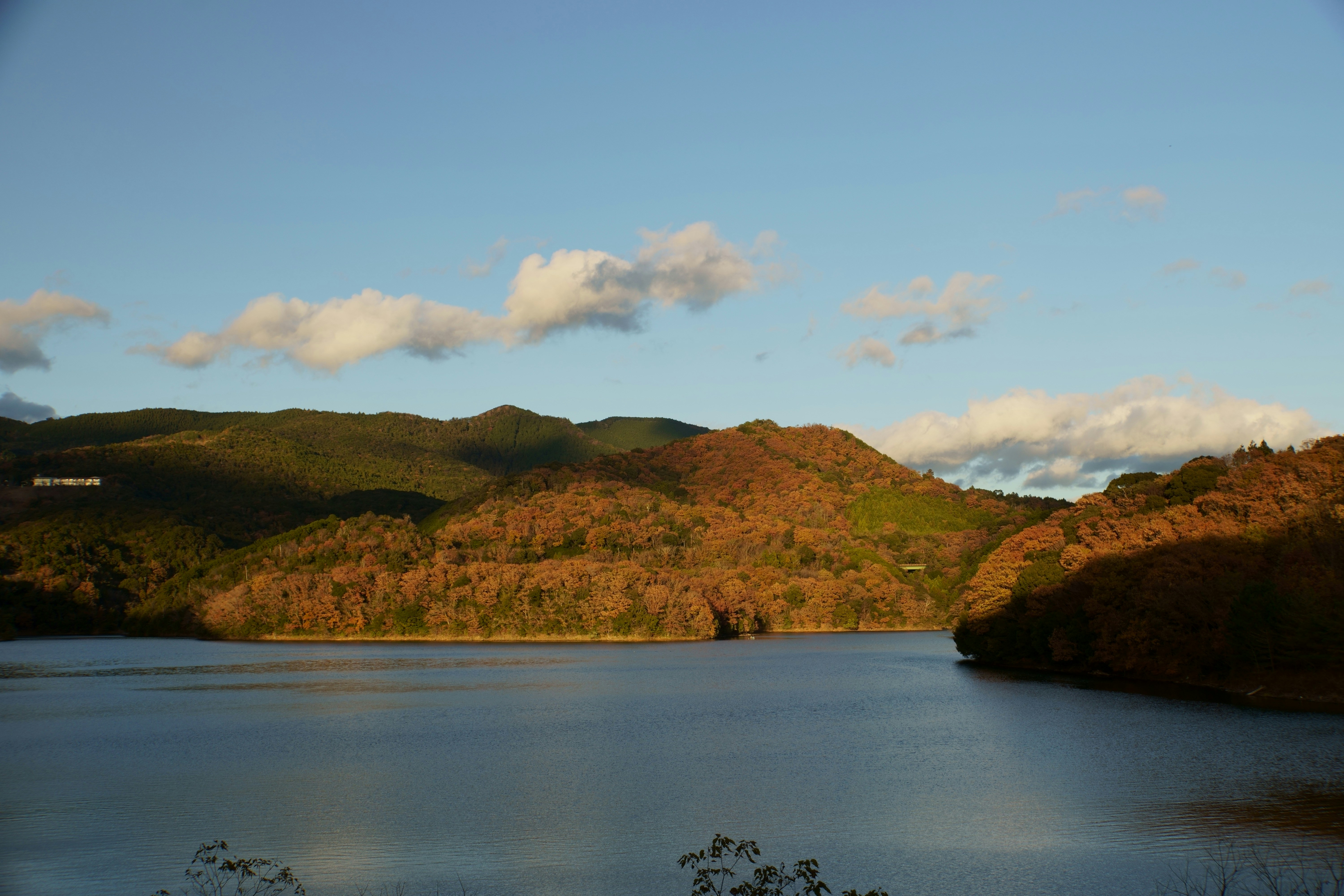 Golden Hour Serenity Over Mountain Lake