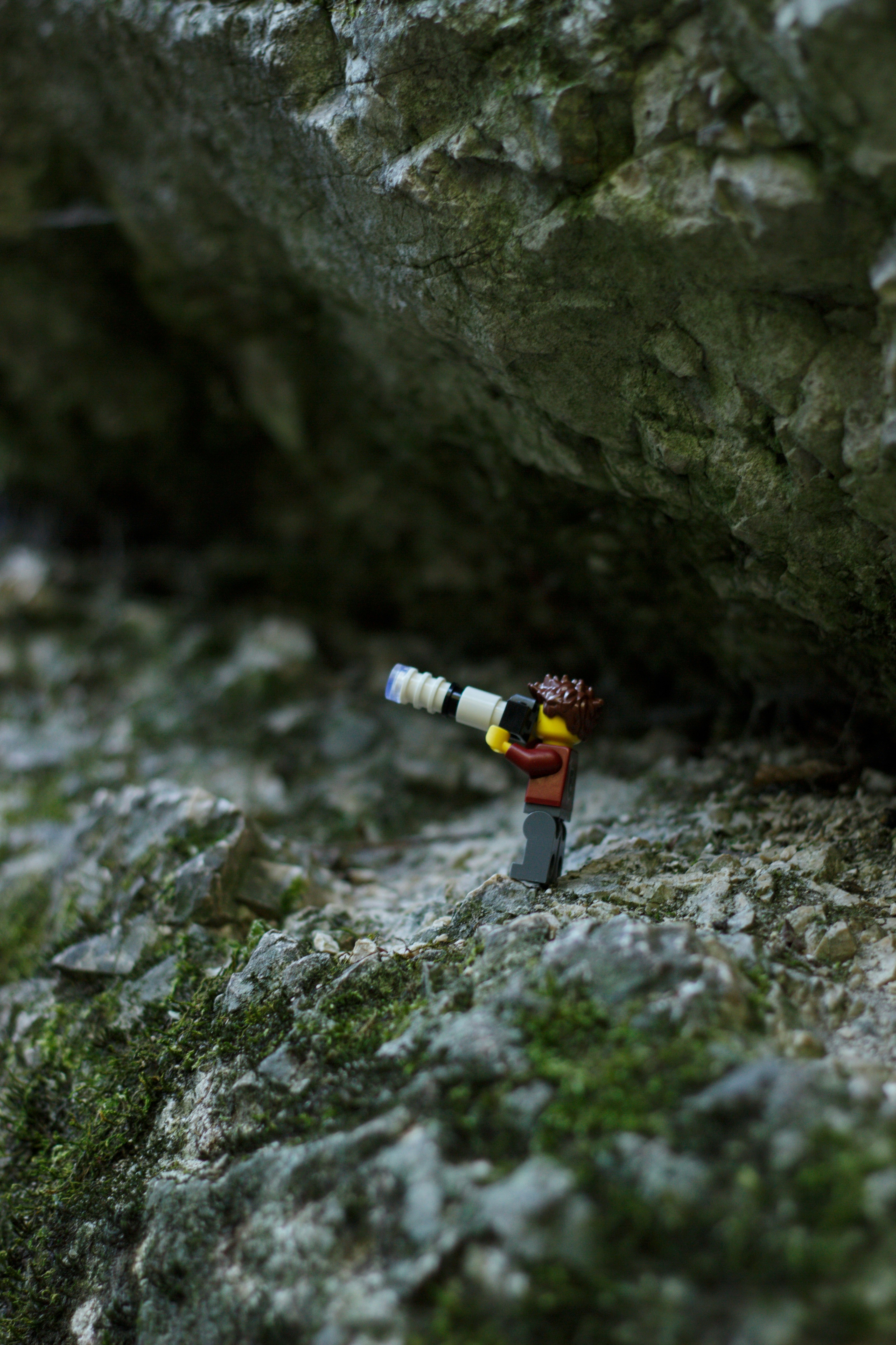 Ridge Reconnaissance: A LEGO Scout Aims a Telescope Across Mossy Granite