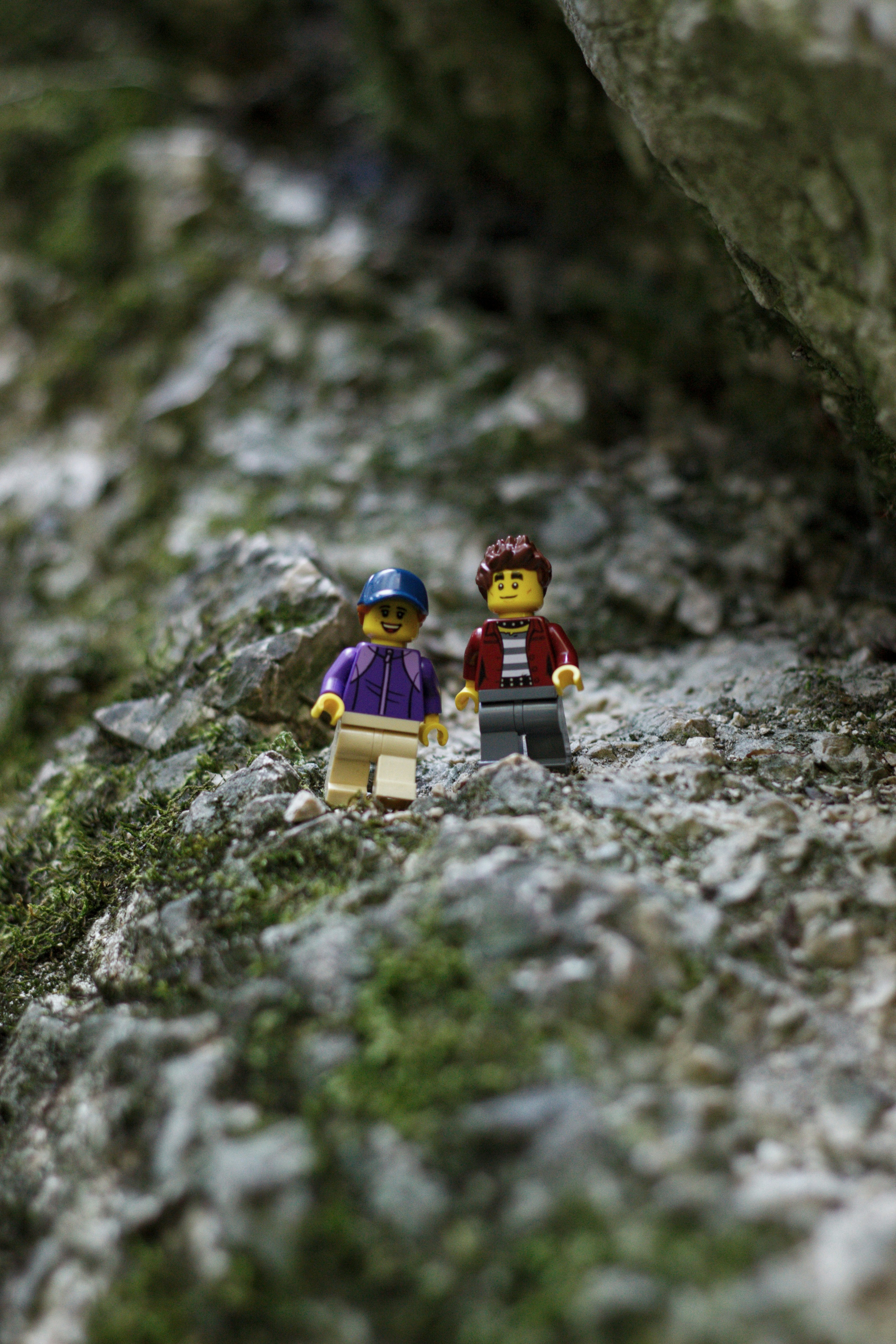 Mossy Ridge Trek: Two LEGO Explorers on a Rocky Path