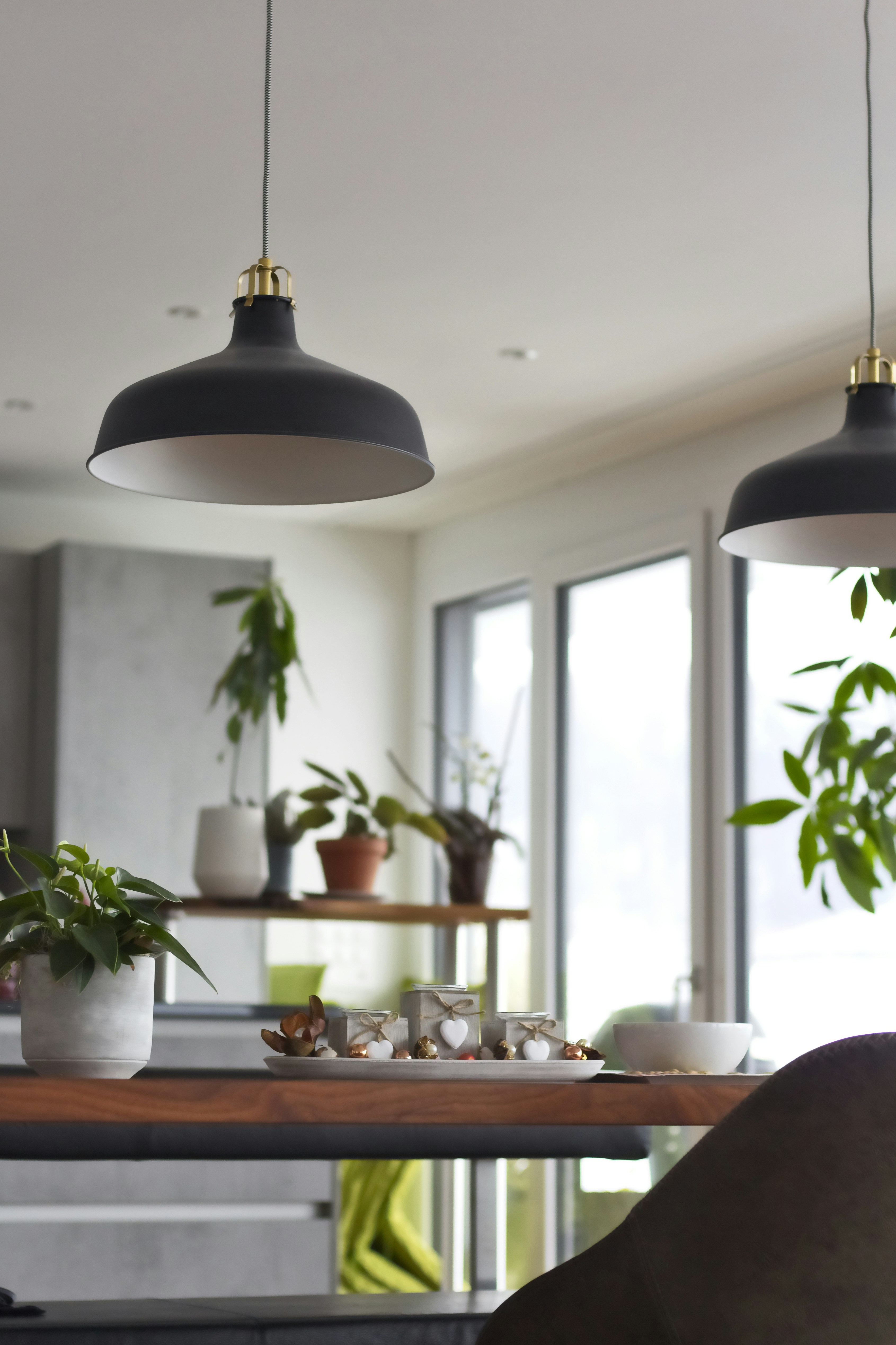 A couple of lights hanging from a ceiling photo – Free Living room ...