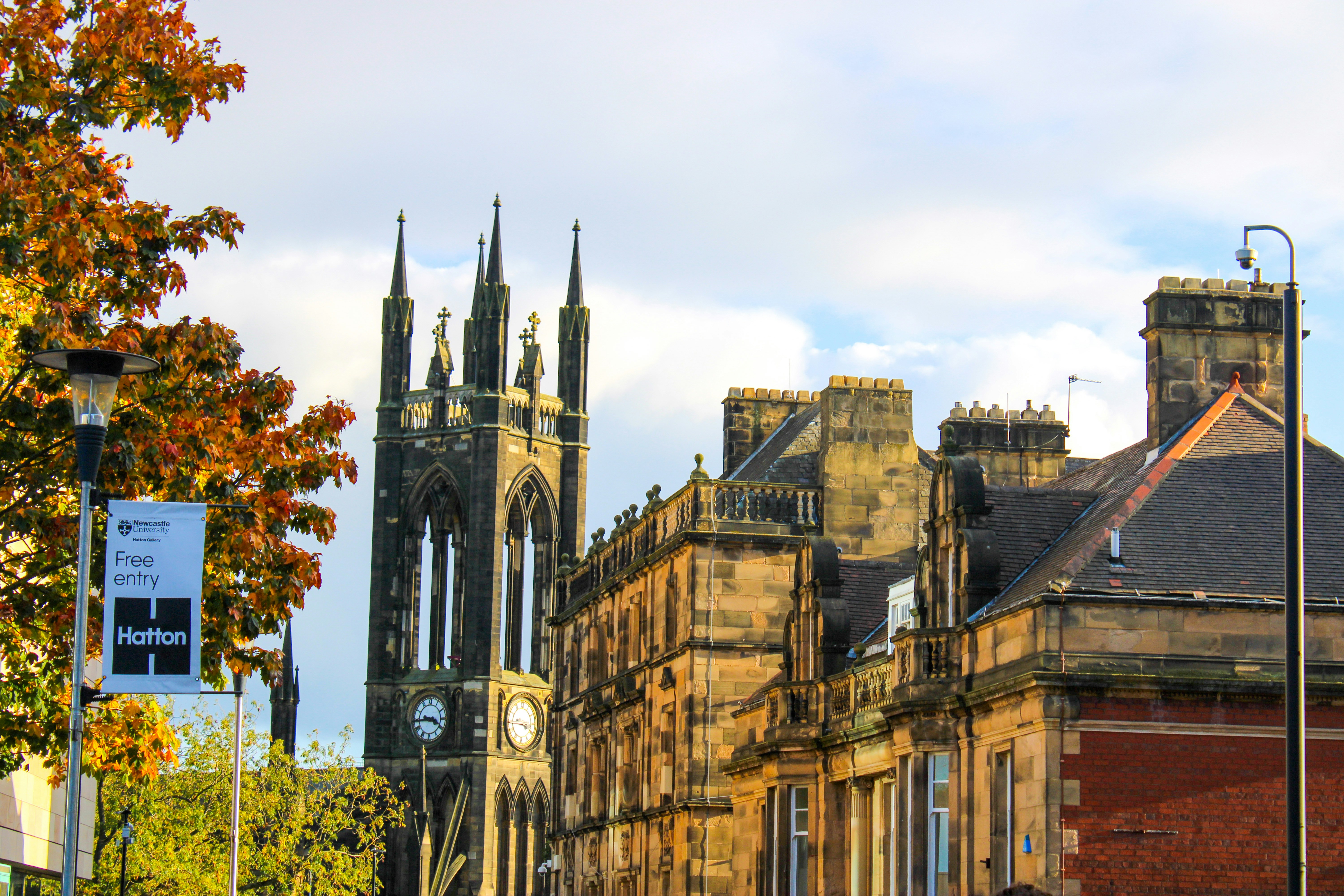 A tall building with a clock on the front of it photo – Free Newcastle ...