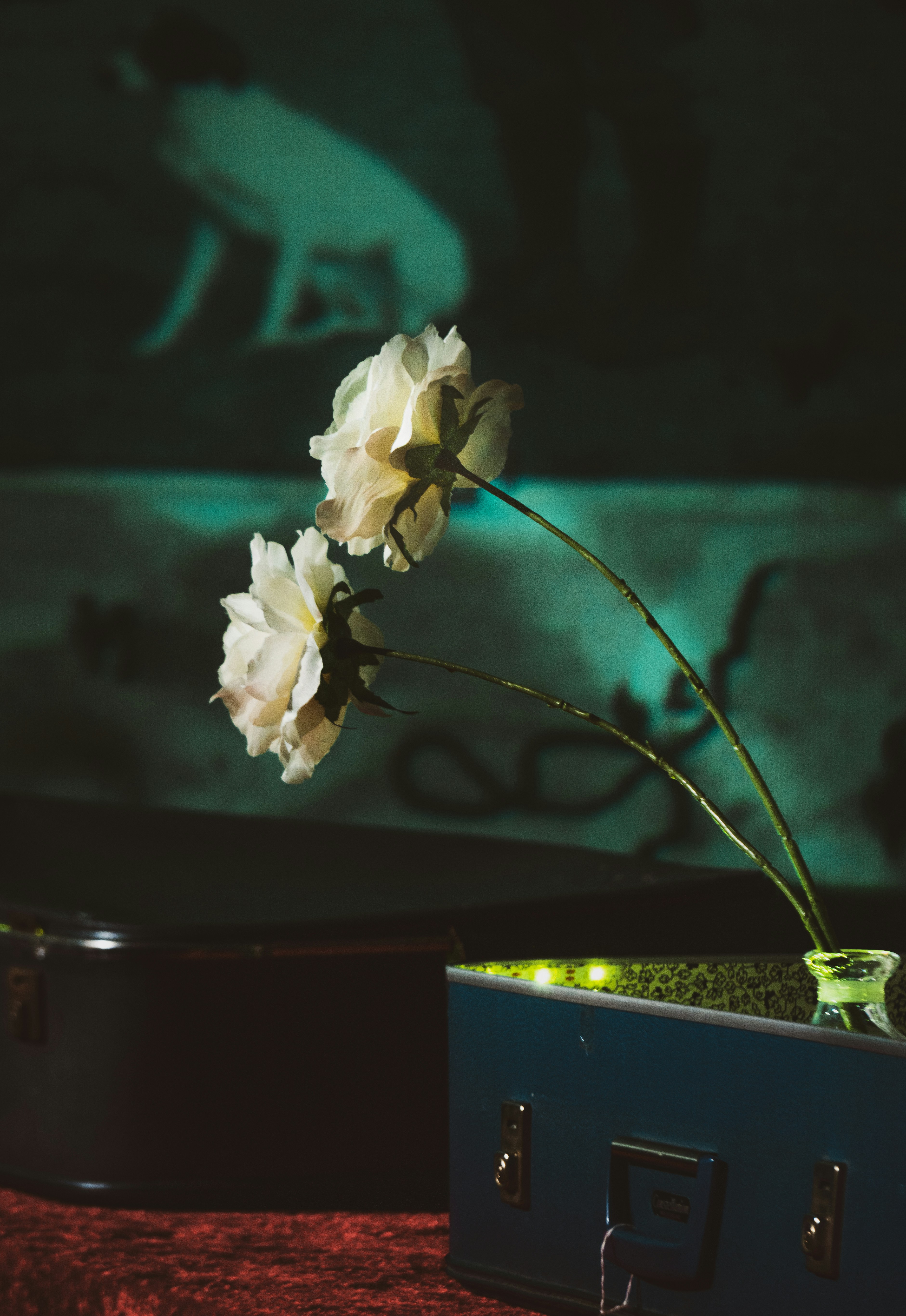 a vase with flowers in it sitting on a table
