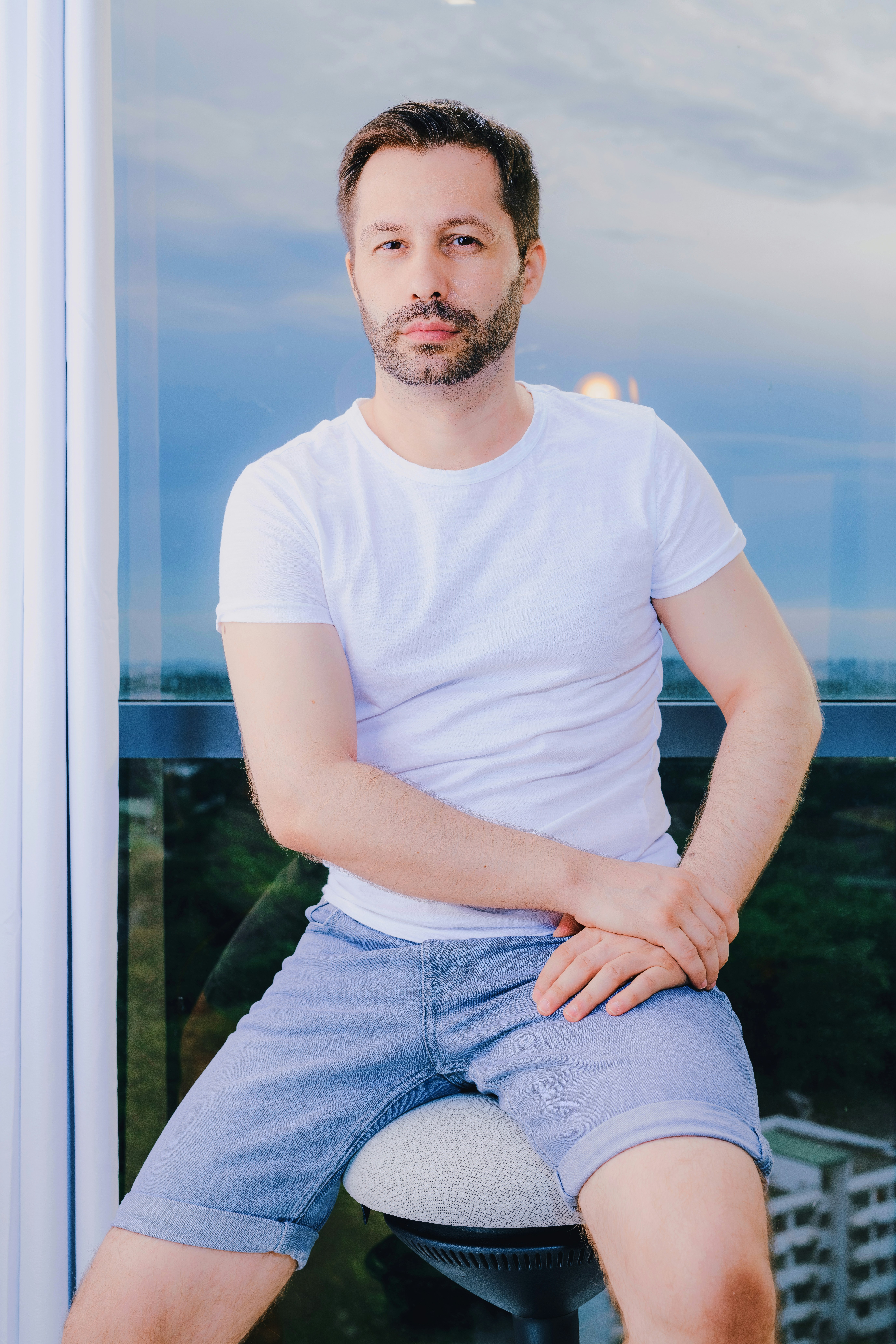 A man sitting on top of a white toilet photo – Free Male pose Image on ...