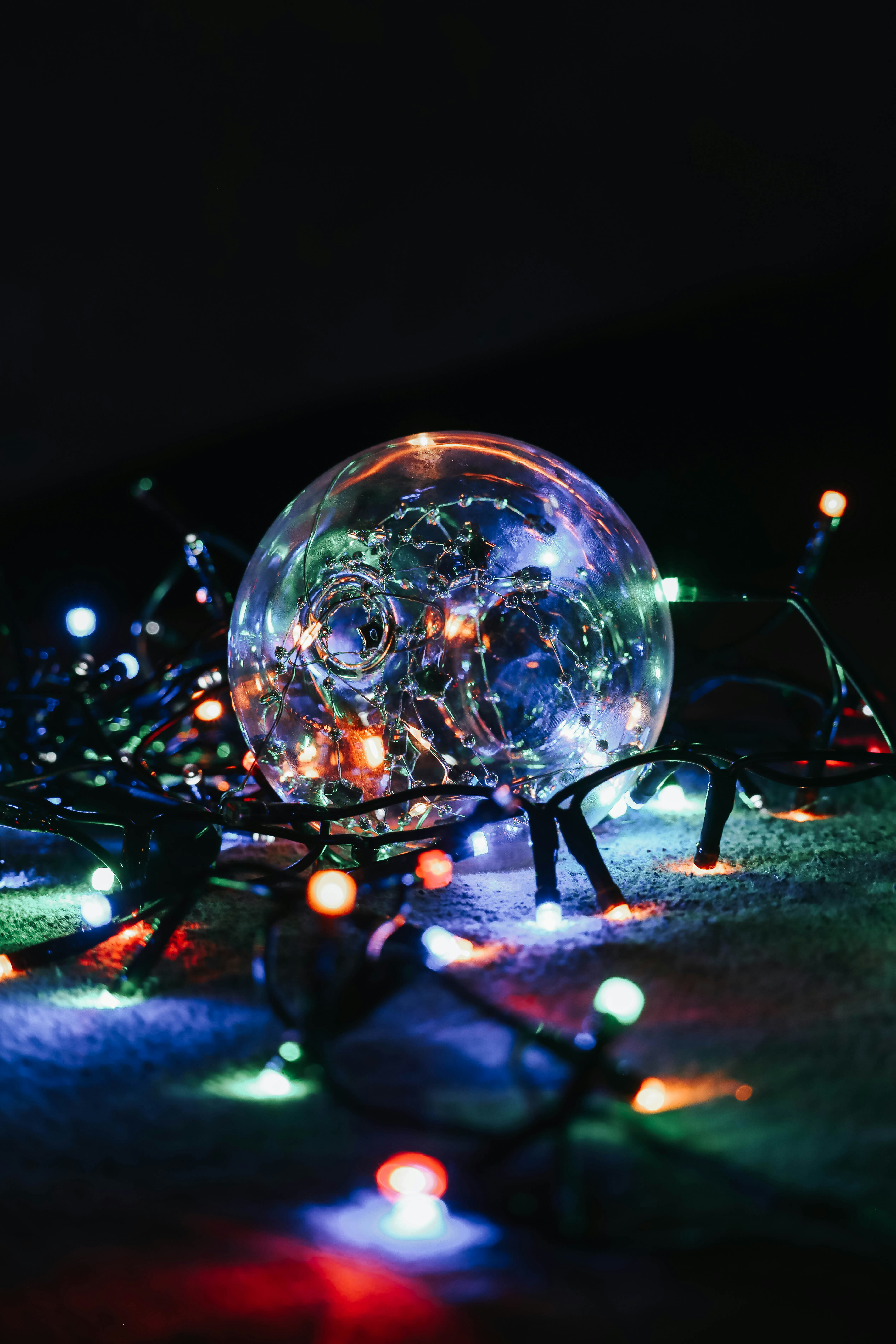 Orb of Neon: A Crystal Globe Amid Twinkling Fairy Lights
