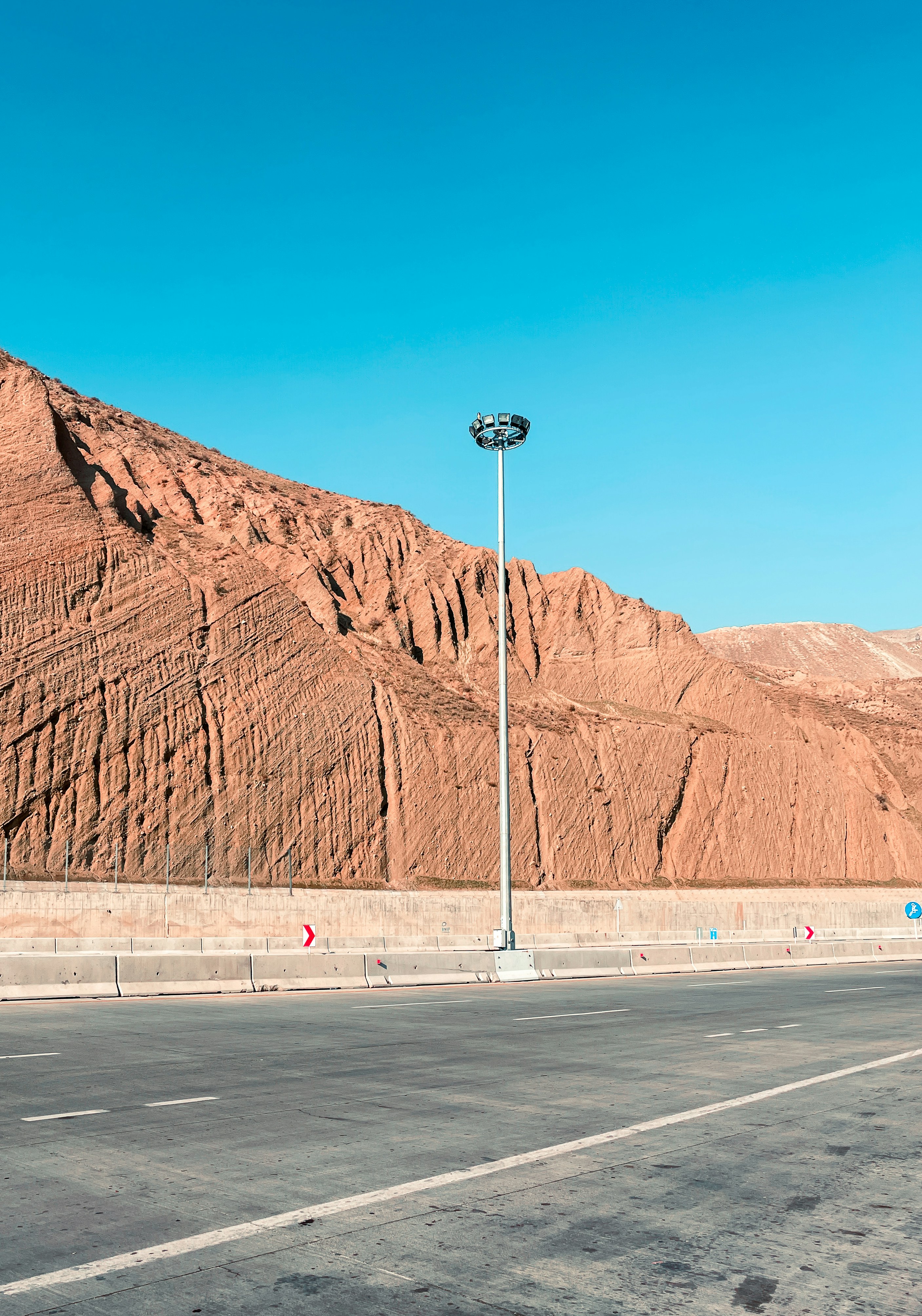 Desert Rock Canyon Under a Clear Blue Sky with a Street Lamp
