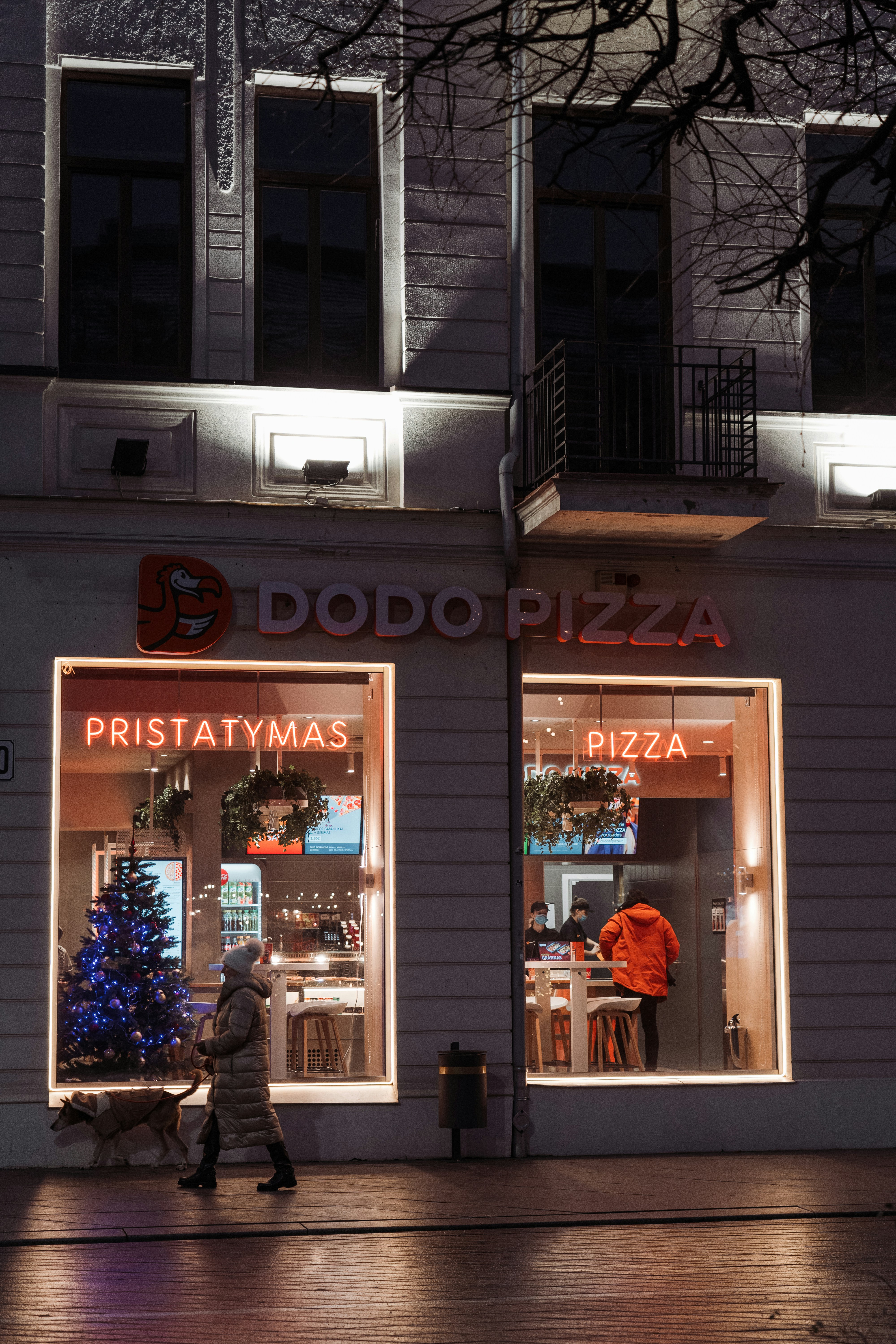 Neon Window Pulse: Dodo Pizza at Night