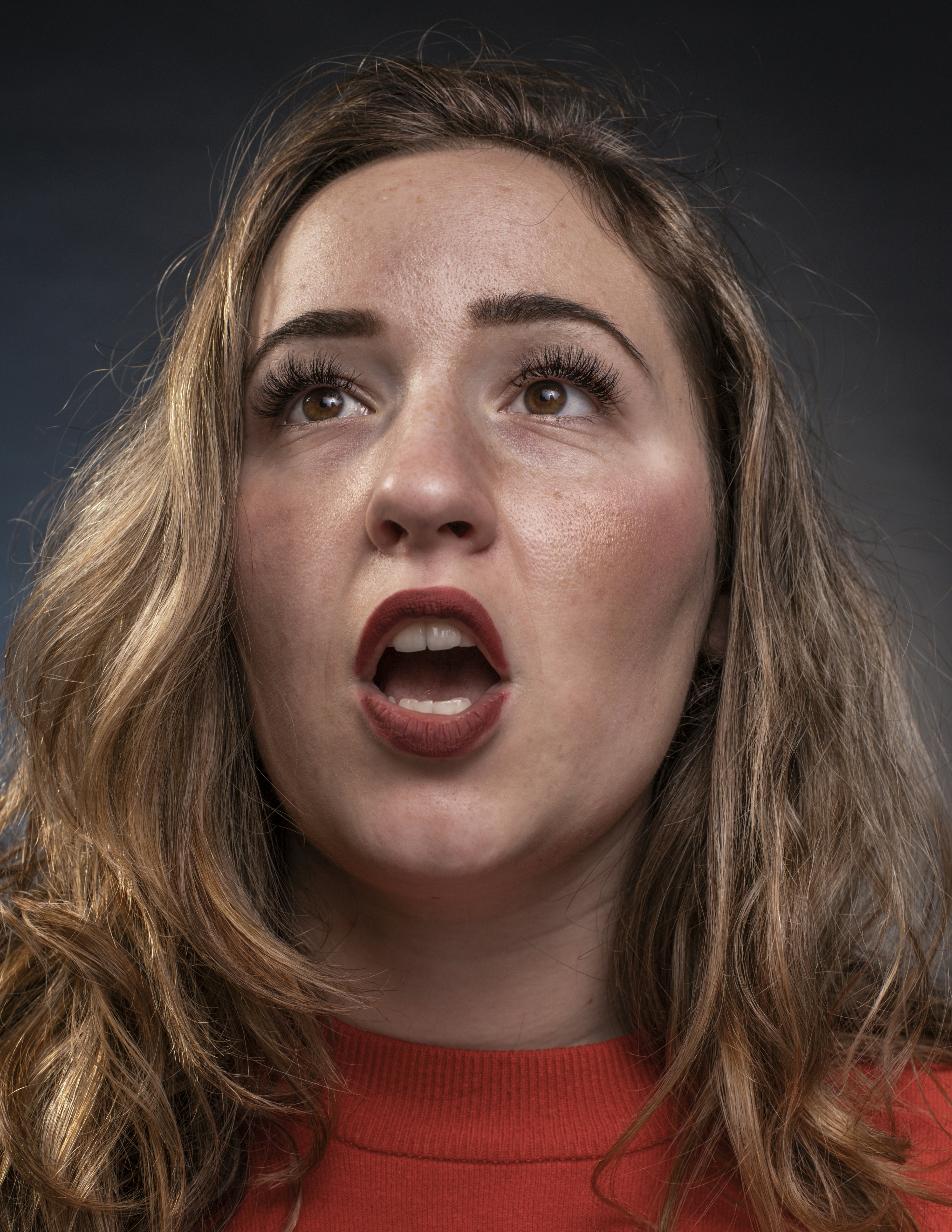 A woman with a surprised look on her face photo – Free Portrait Image ...