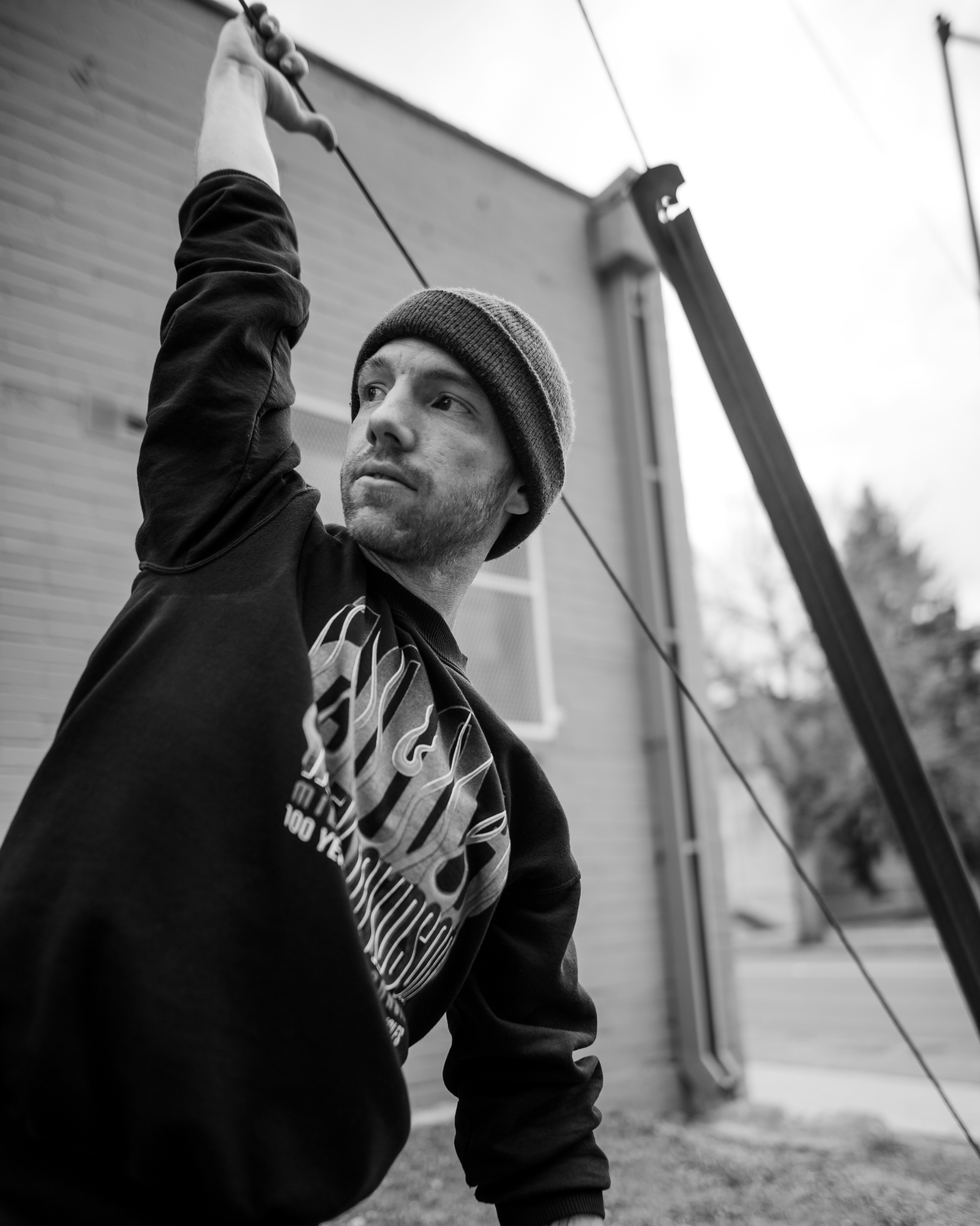 Tension on a Thin Line: Beanie-Clad Portrait in Mono