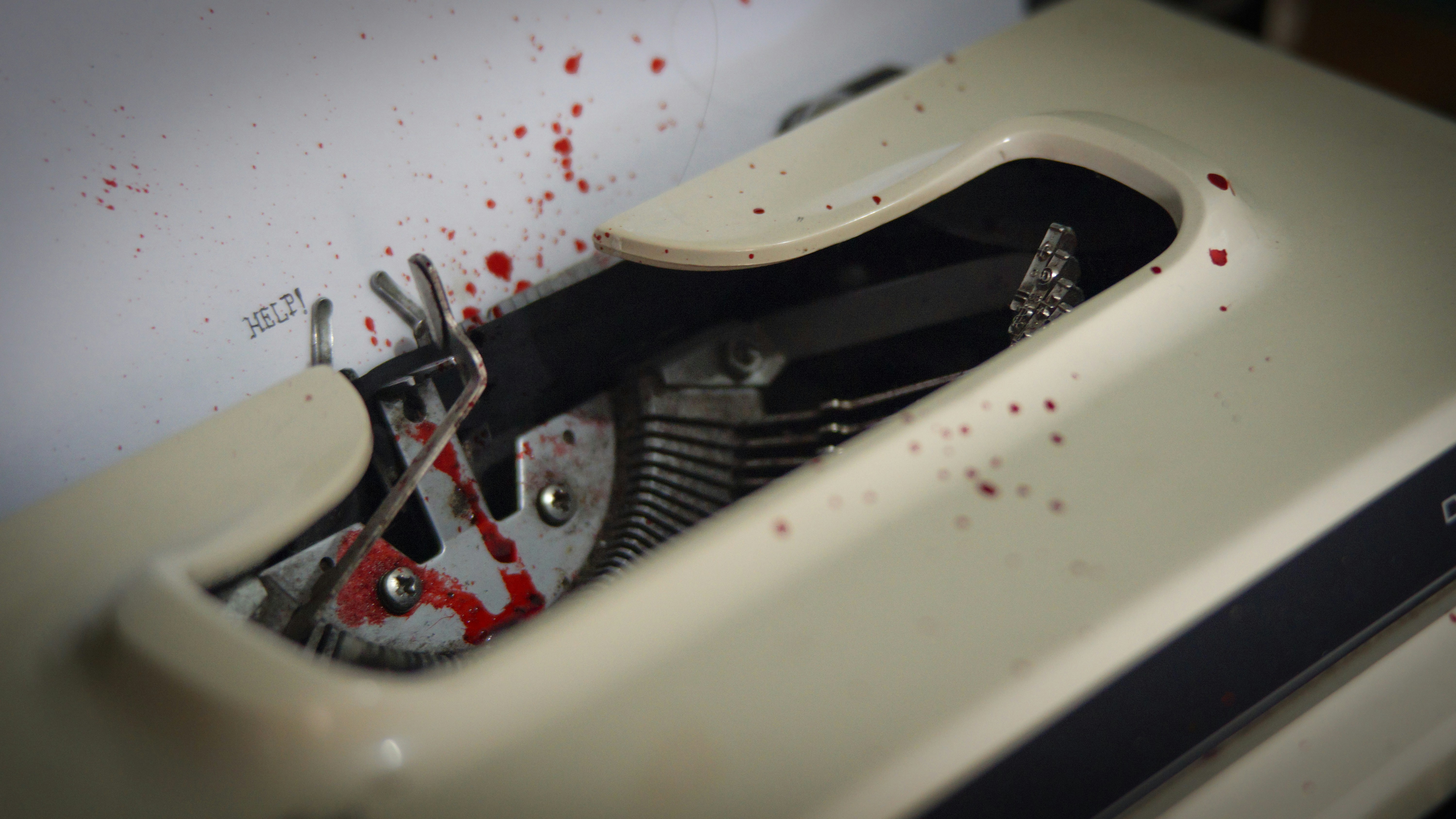A close up of a typewriter with blood all over it photo – Free Machine ...